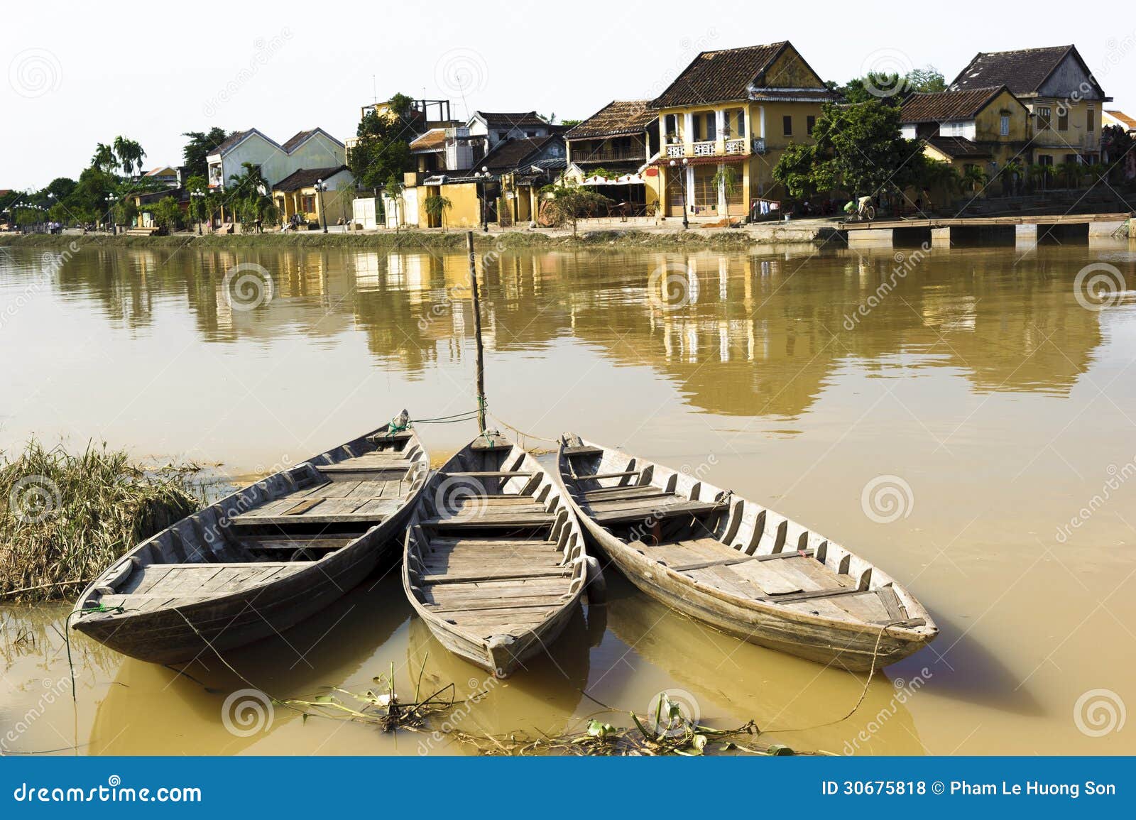 Ancient Town Viewed from the River with Rowboats Stock Photo - Image of ...