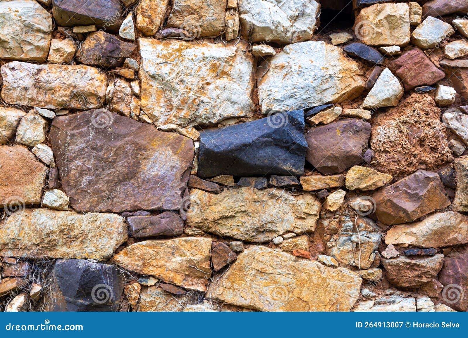 Ancient Wall of Rocks of Different Colors. Middle Ages Wall Stock Image ...