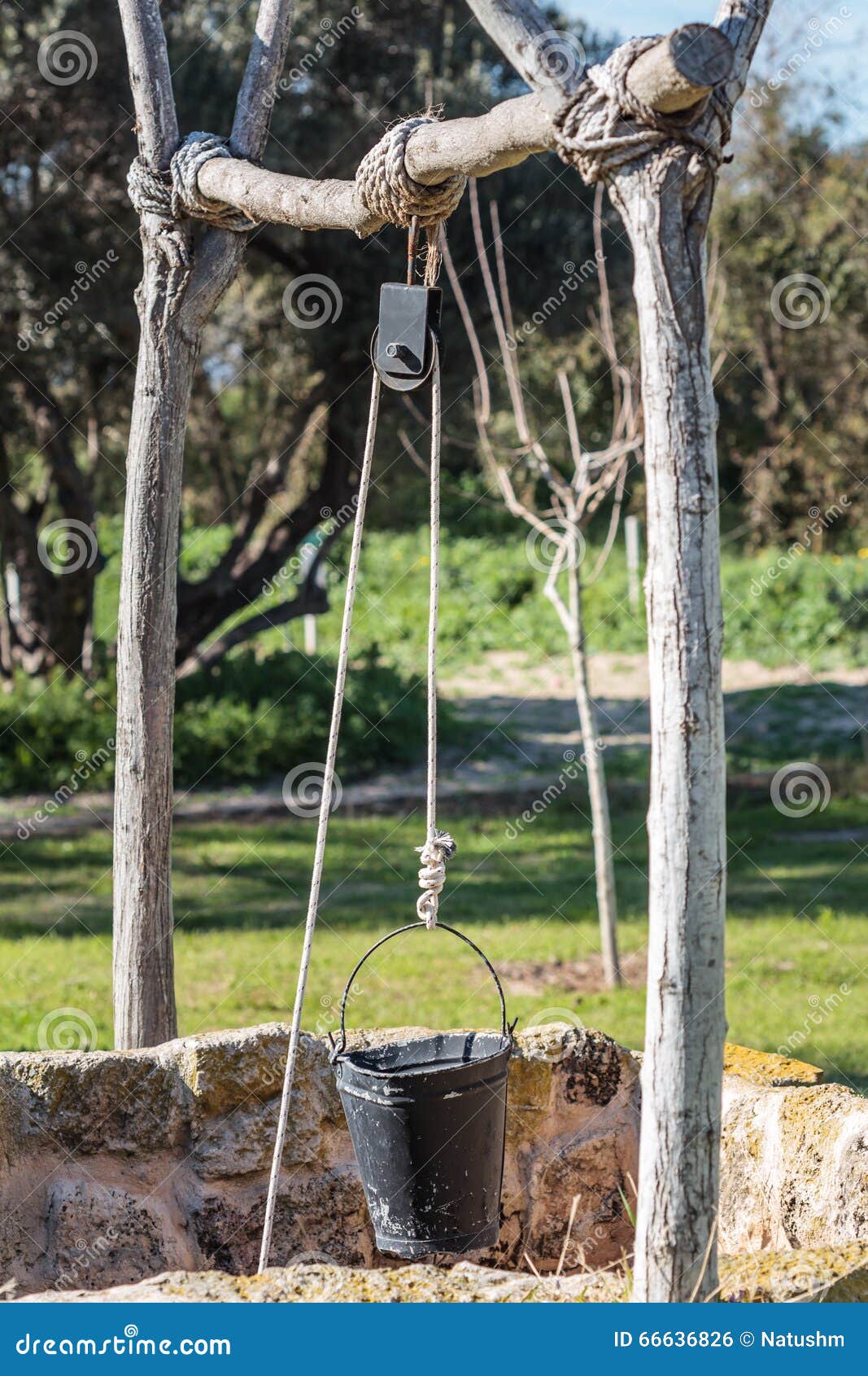 Ancient Water Well with a Bucket Stock Photo - Image of summer, shaft ...