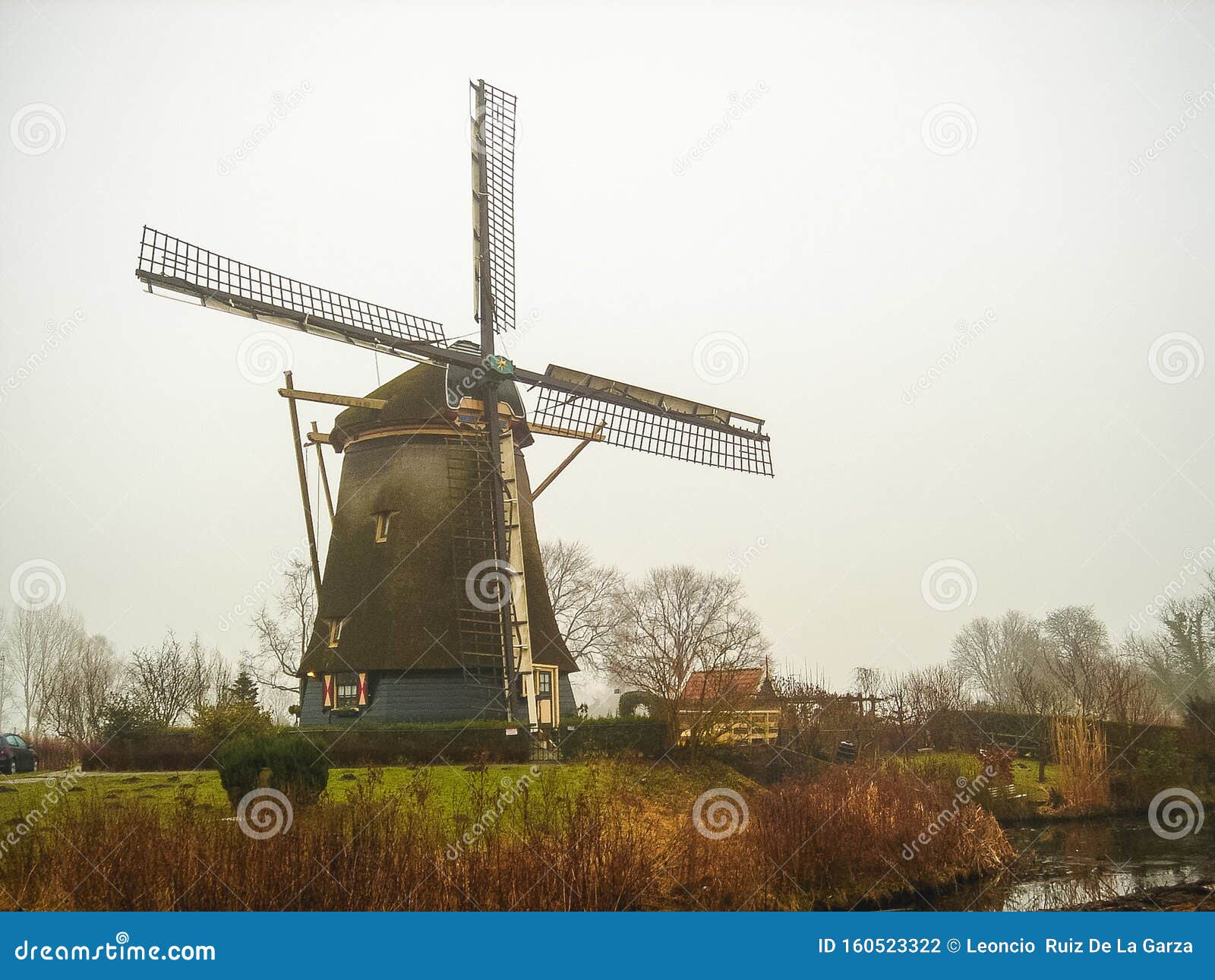 Ancient Windmill on the Shore of a Lake. Stock Photo - Image of ancient ...
