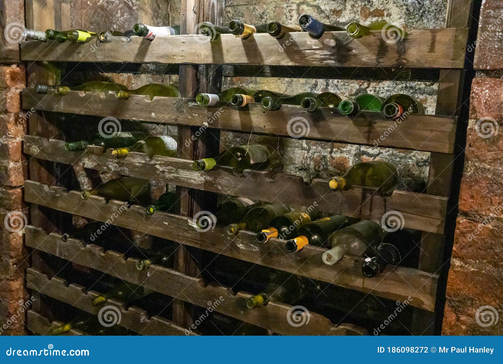 Ancient Wine Rack with Empty Bottles of Wine Stock Photo - Image of ...