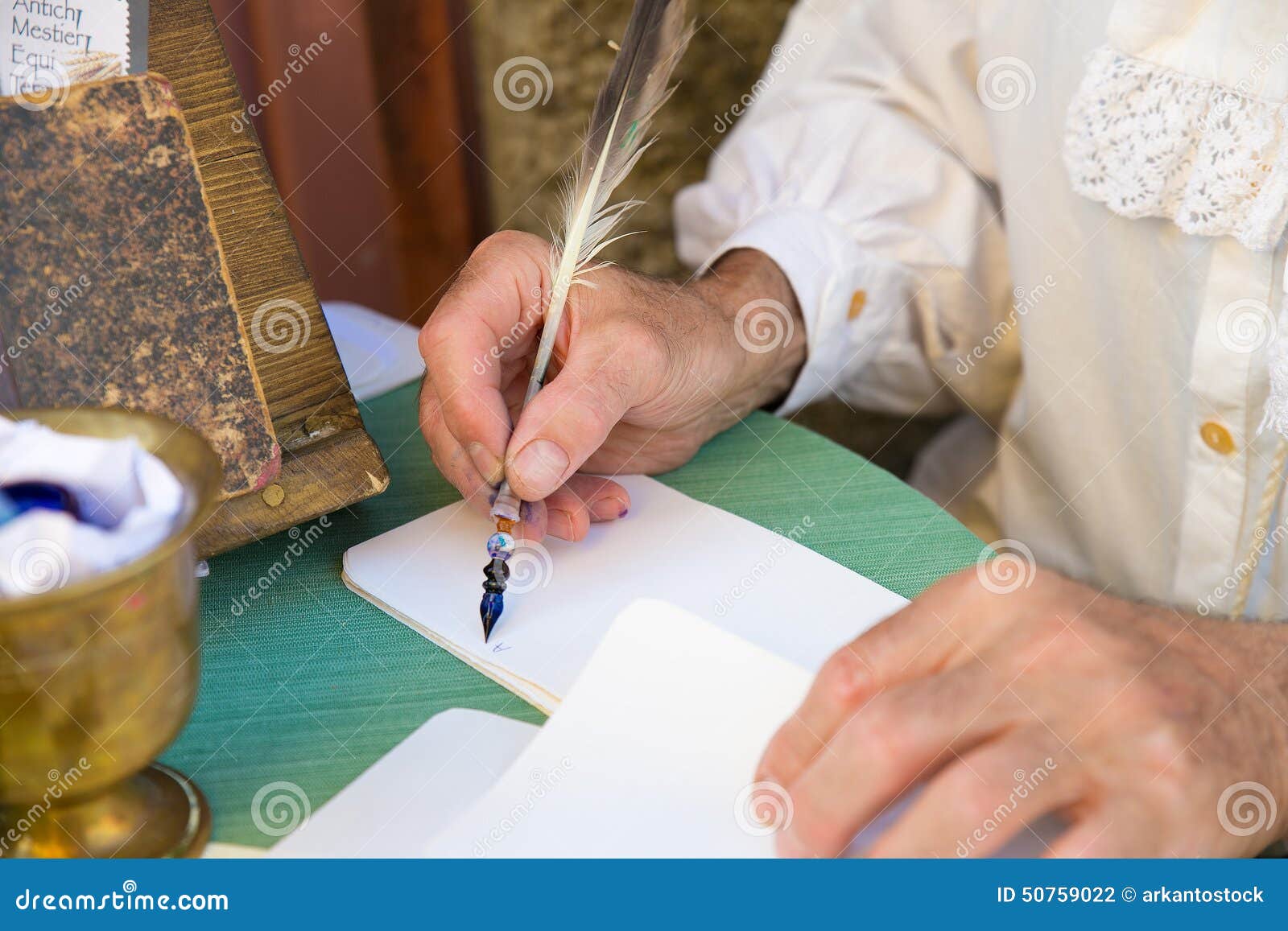 An Ancient Writer Holding a Pen Made of Feather in Tuscany Stock Photo ...