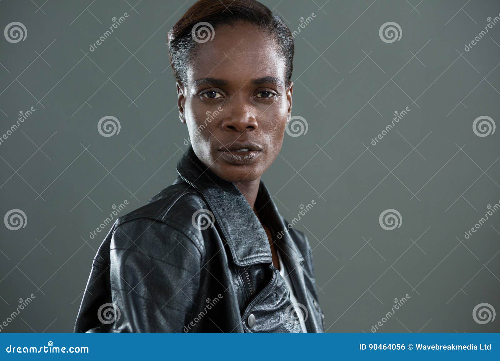 Androgynous Man in Black Jacket Posing Against Grey Background Stock ...