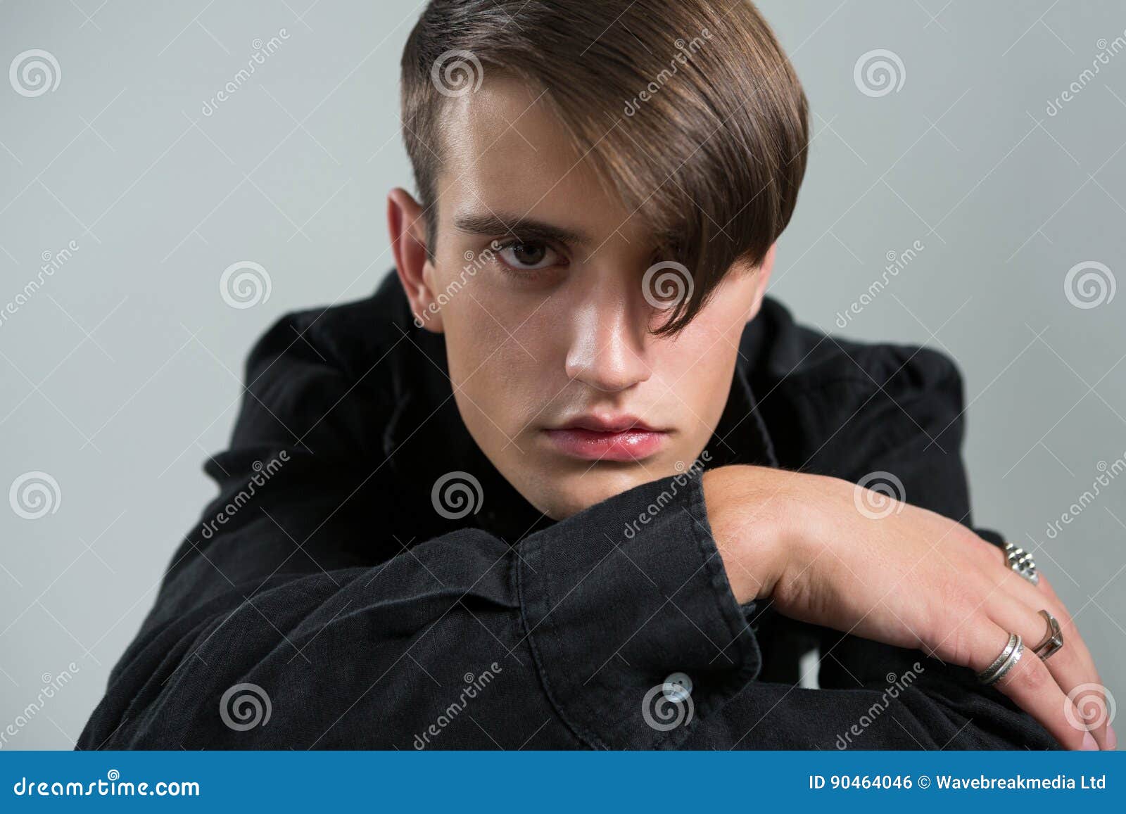 Androgynous Man in Black Shirt Posing Against Grey Background Stock ...