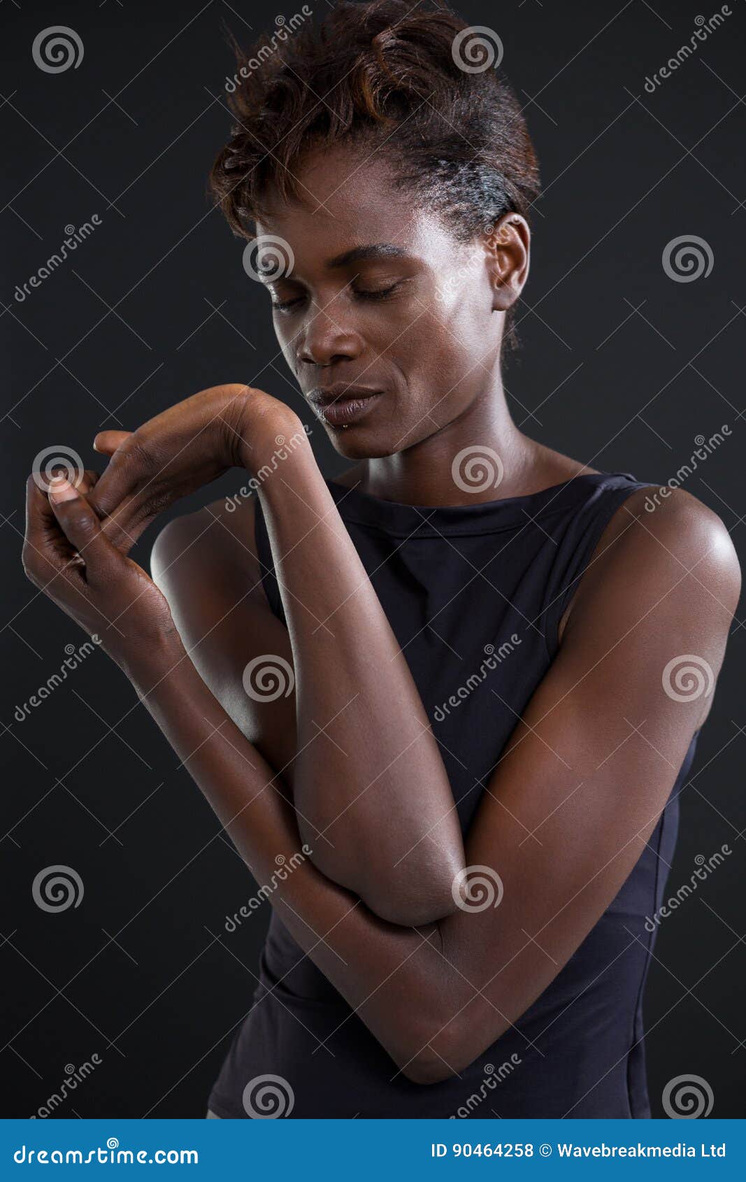 Androgynous Man Posing Against Grey Background Stock Photo - Image of ...