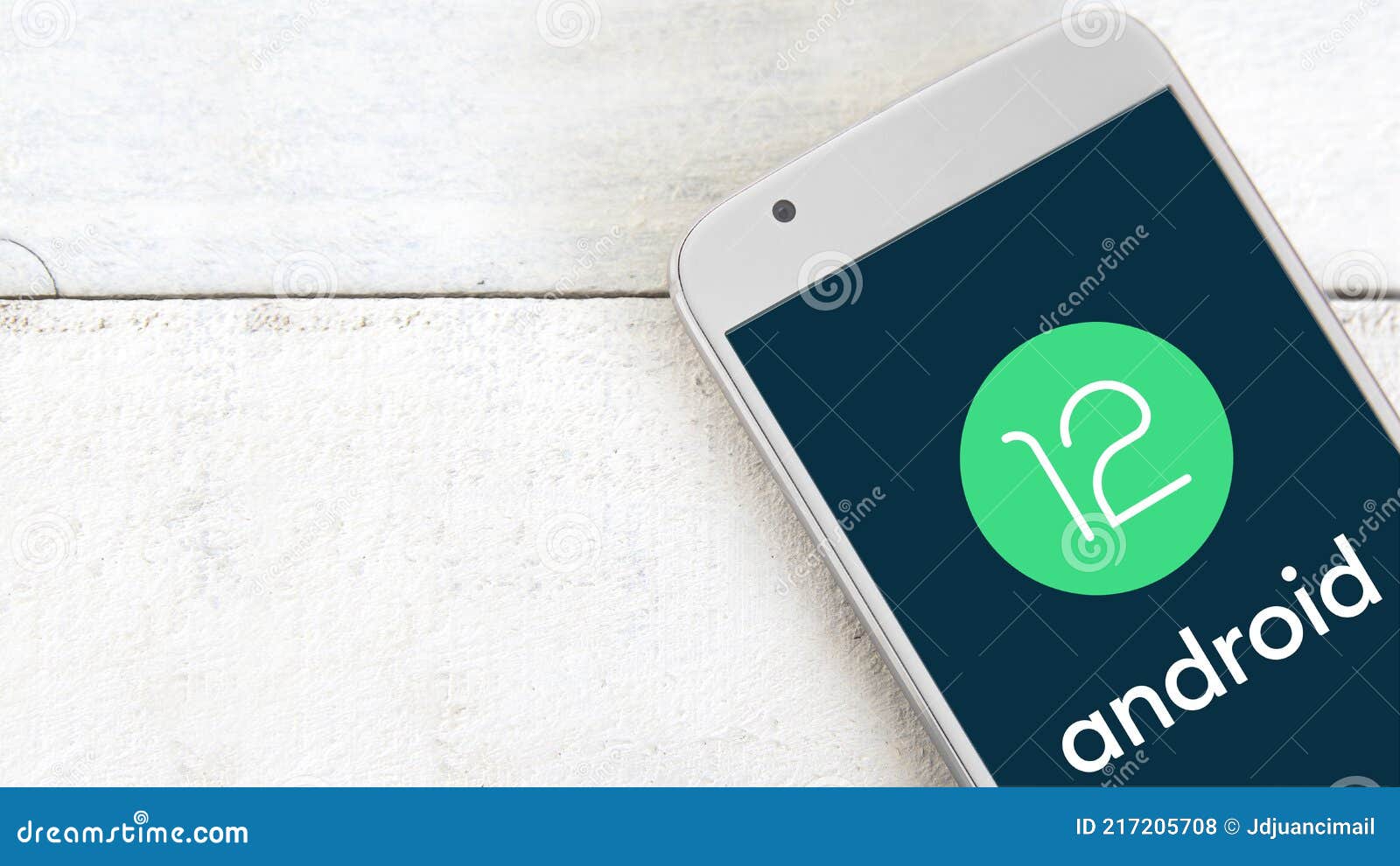 Android 12 Logo on a Screen of a Mobile on a White Wooden Table ...