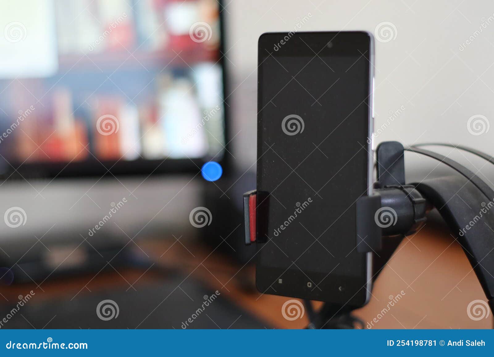 Android Smartphone on Holder in Front of Computer Monitor. Stock Image ...