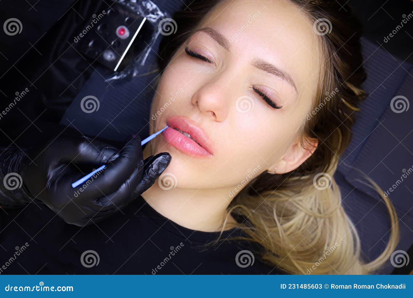Anesthesia To the Model`s Lips with a Small Blue Brush before the ...