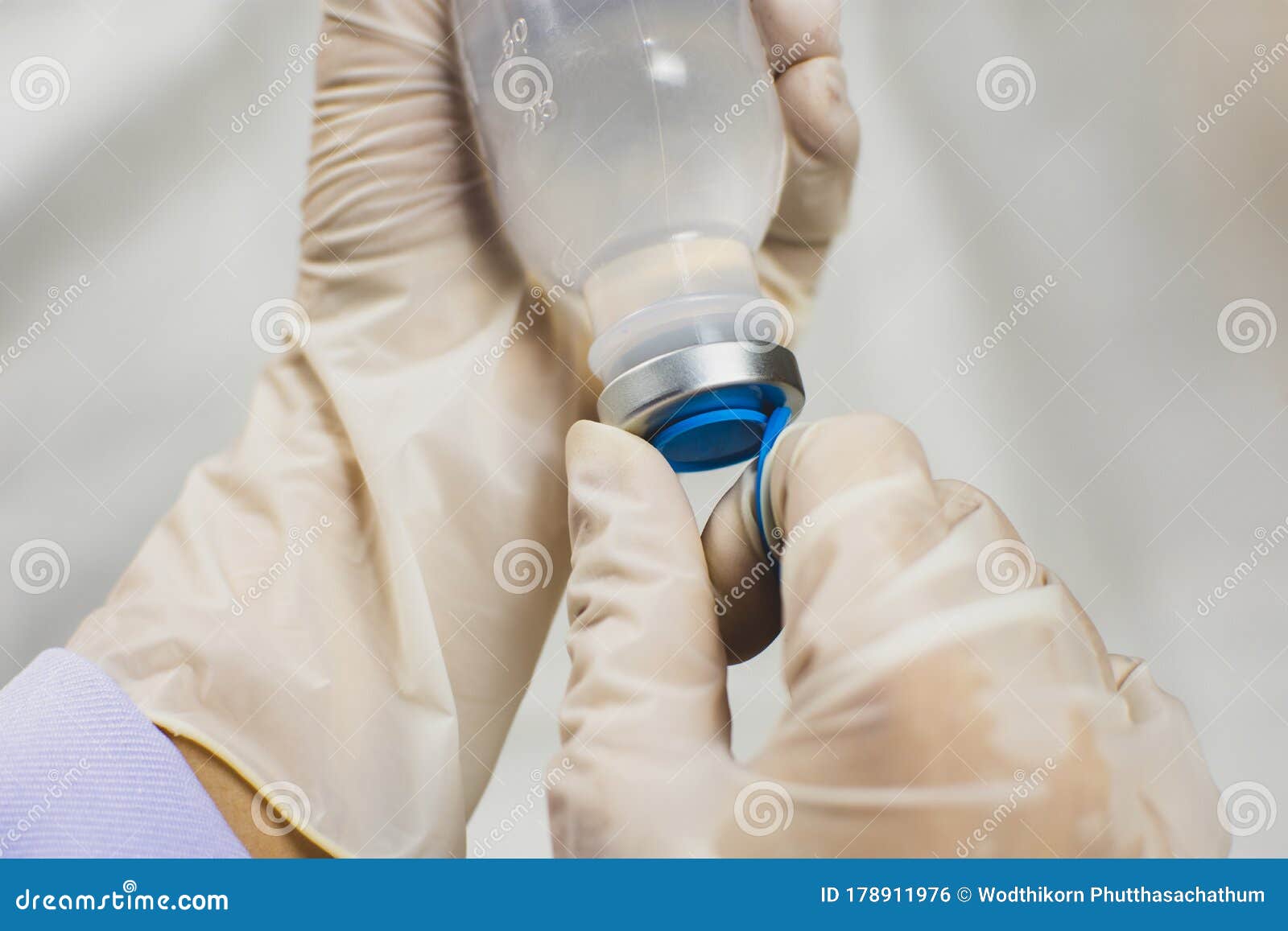 Anesthesiologist Doctors Hand is Opening Normal Saline Solution NSS ...