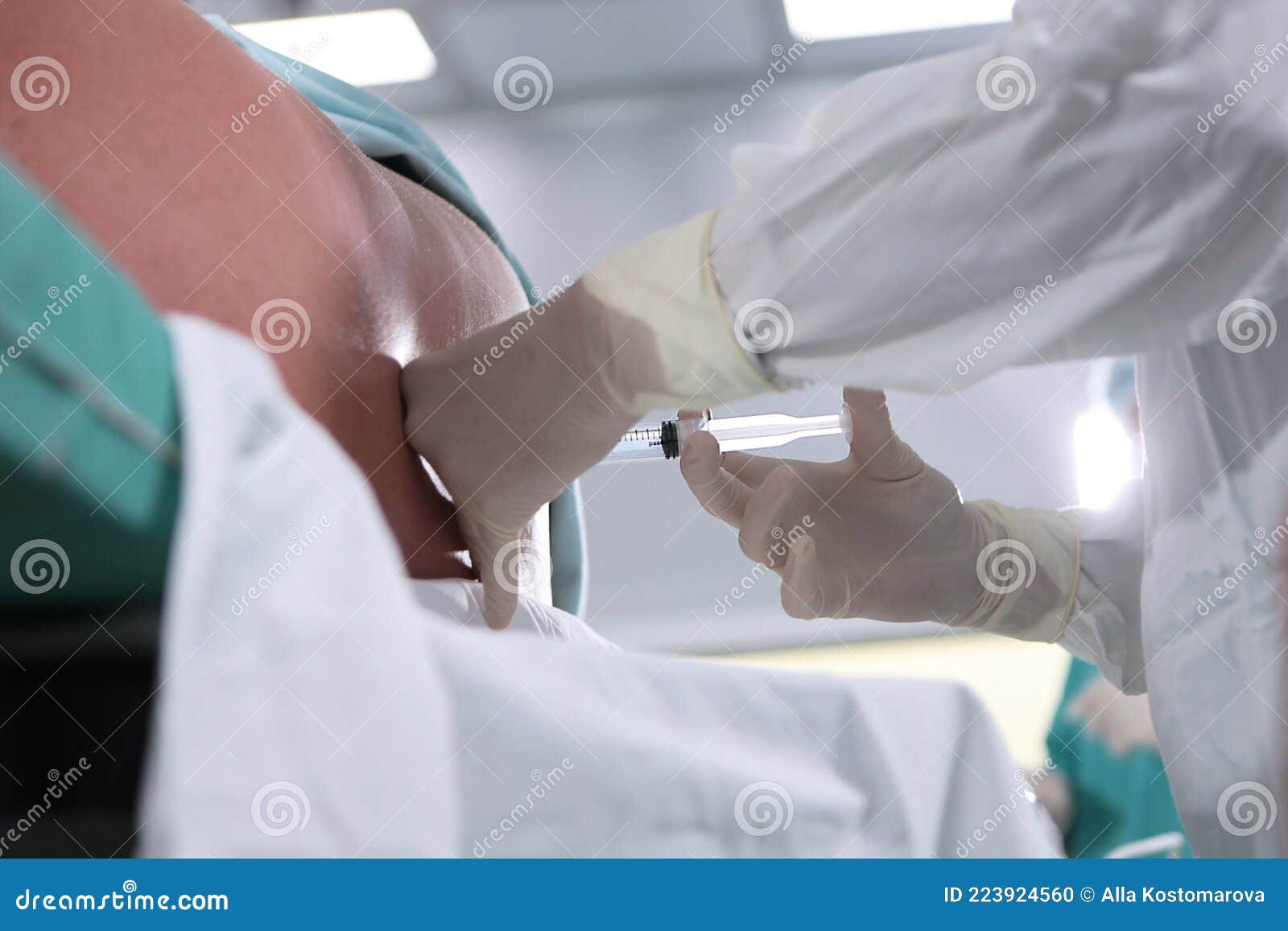 The Anesthesiologist Performs an Epidural Anesthesia on the Patient`s ...