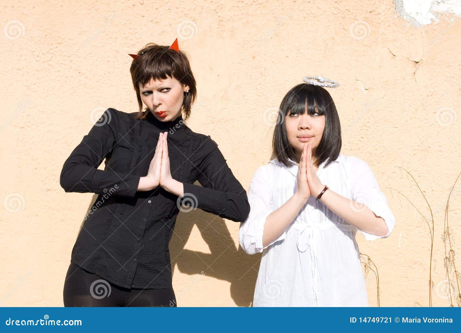 Angel and devil together stock image. Image of female - 14749721
