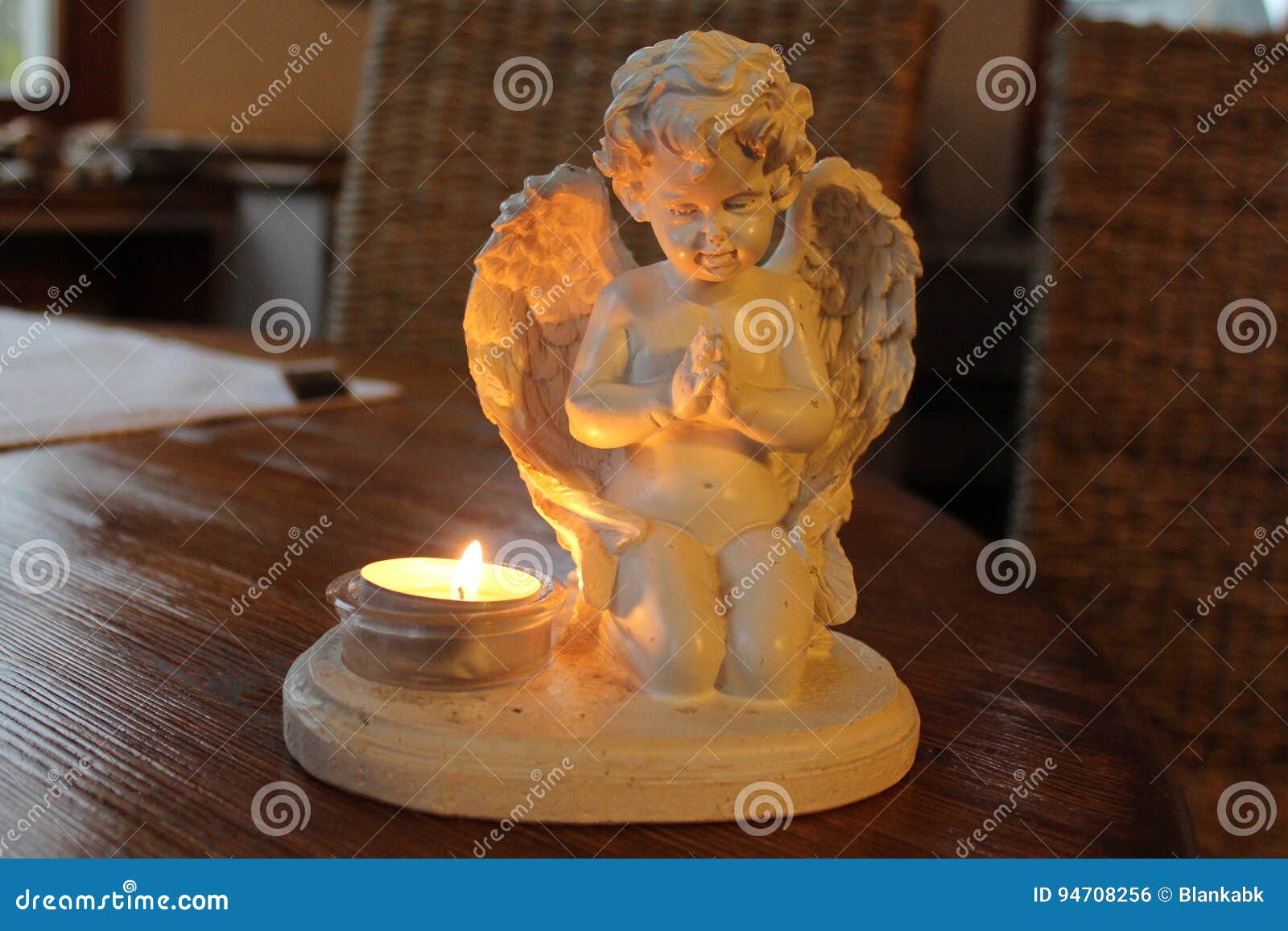 Angel figurine with candle stock photo. Image of ceramic - 94708256