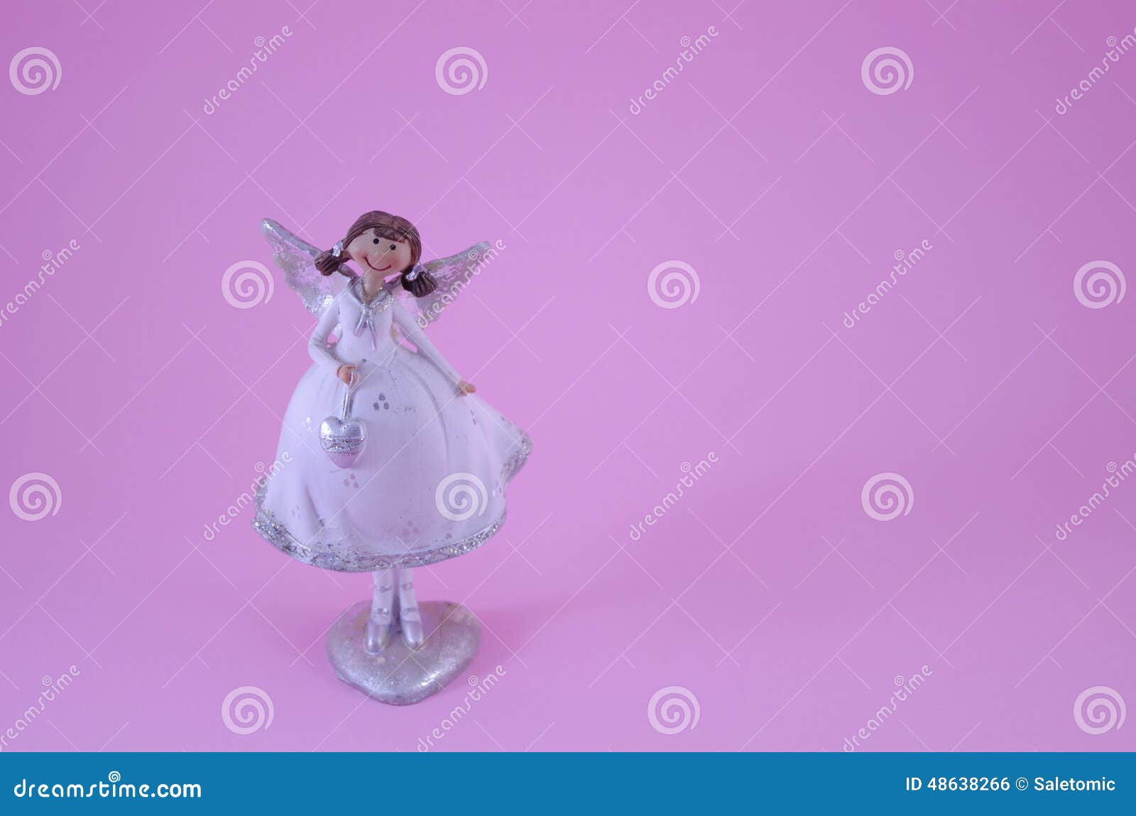 Angel figurine on pink stock photo. Image of blossom - 48638266