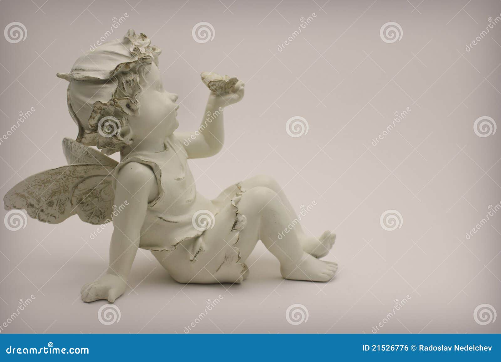Angel holding butterfly stock photo. Image of shadow - 21526776