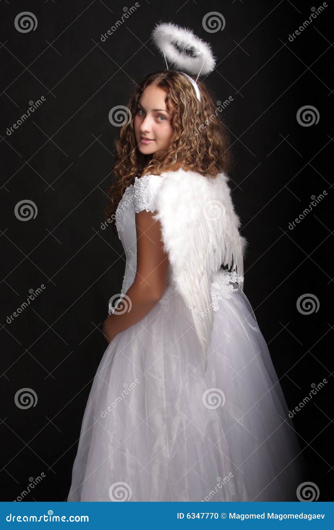 Angel Looking Over Shoulder Stock Photo - Image of model, caucasian ...