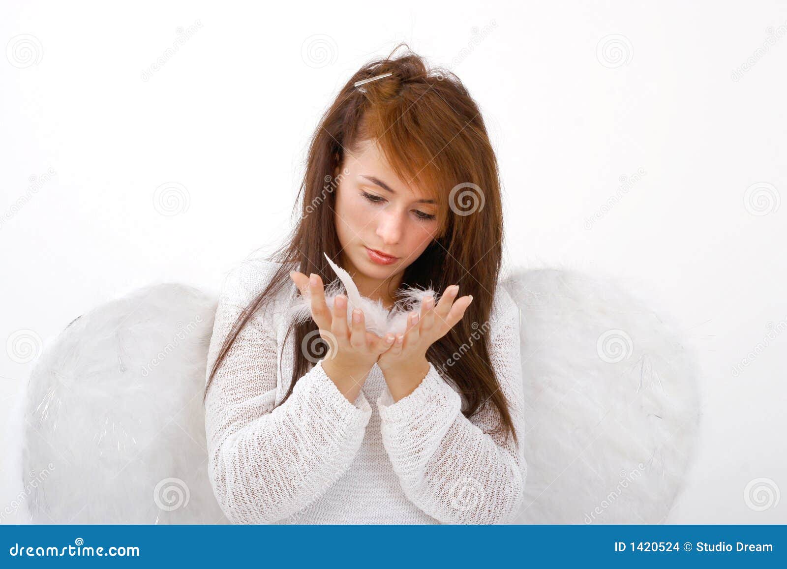 Angel Loosing Her Wings stock photo. Image of tempting - 1420524
