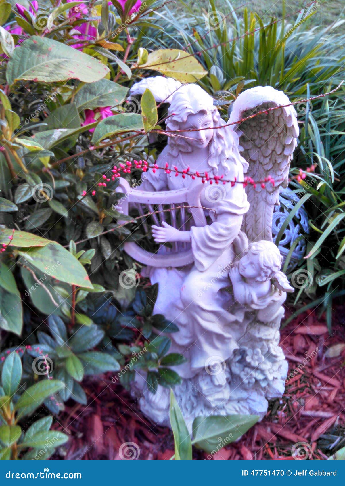 Angel Playing Harp in a Garden Stock Photo - Image of flower, foliag ...