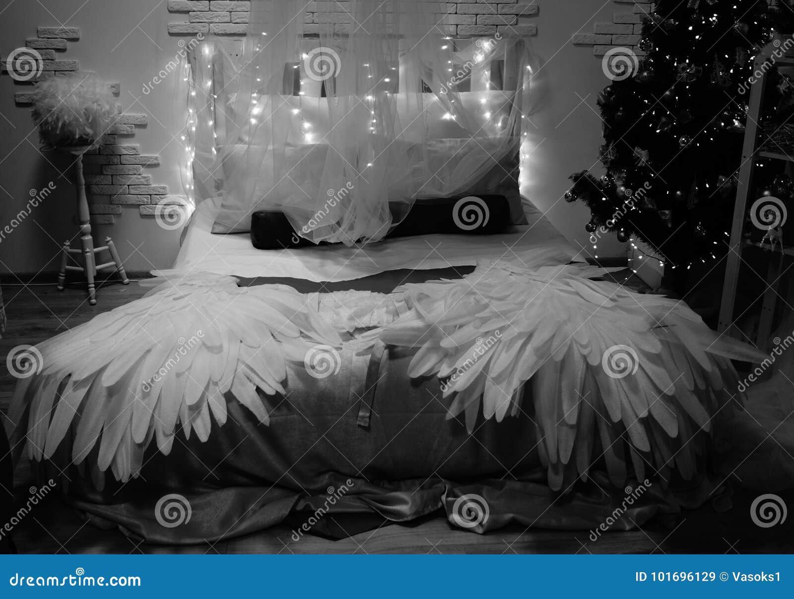 Angel`s Wings Lie on the Bed in Black and White Colors Stock Image ...