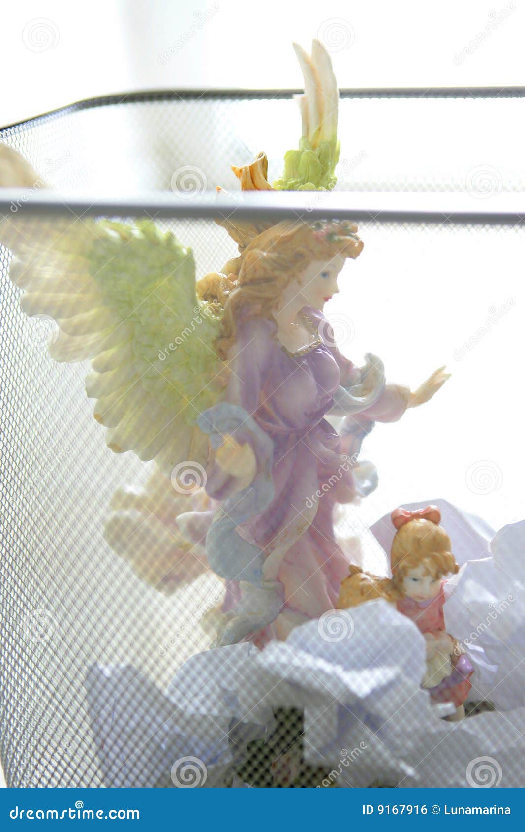 Angel Saint Figure in the Office Trash Stock Photo - Image of garbage ...