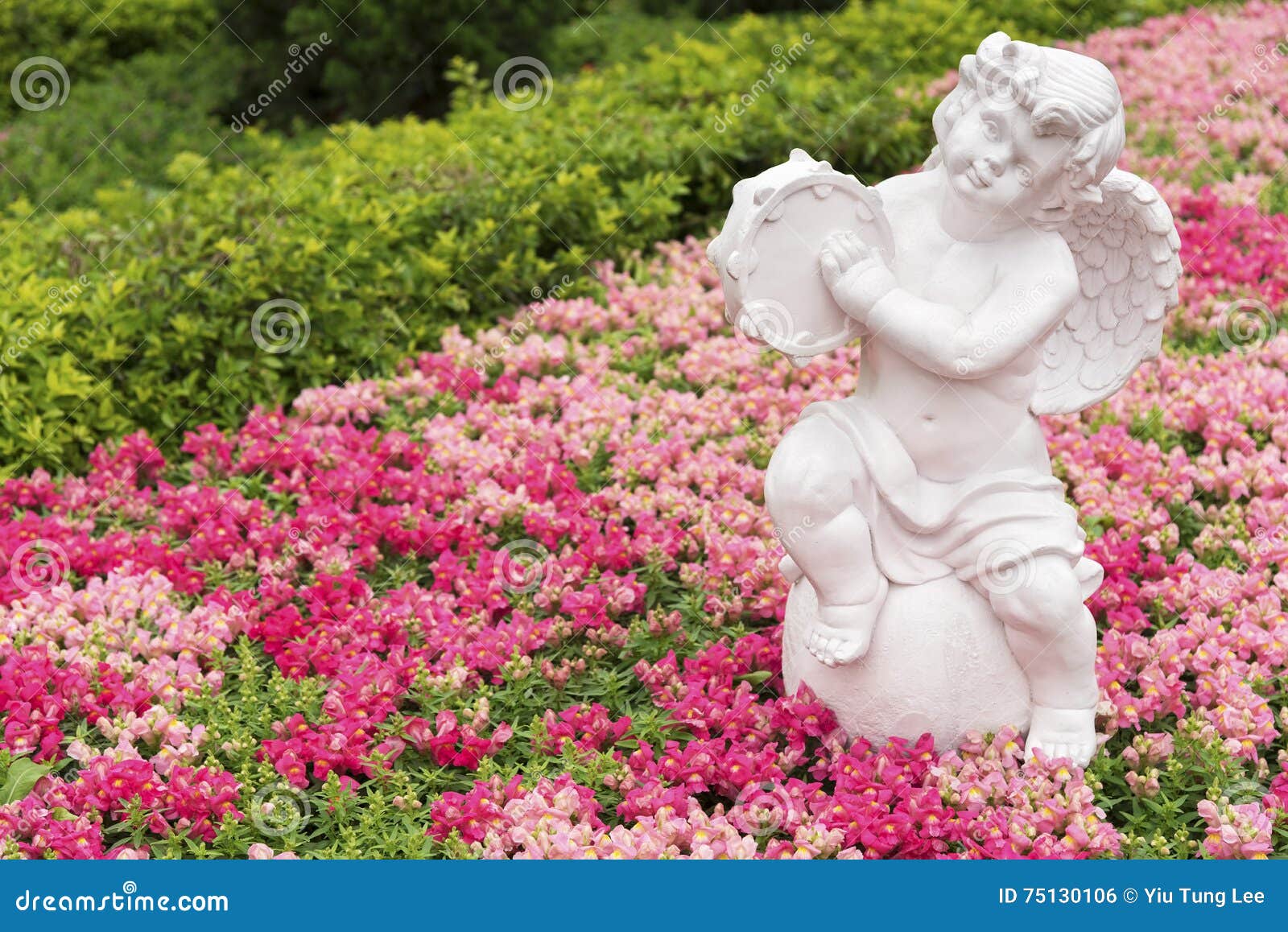 Angel sculpture in garden stock photo. Image of beauty - 75130106