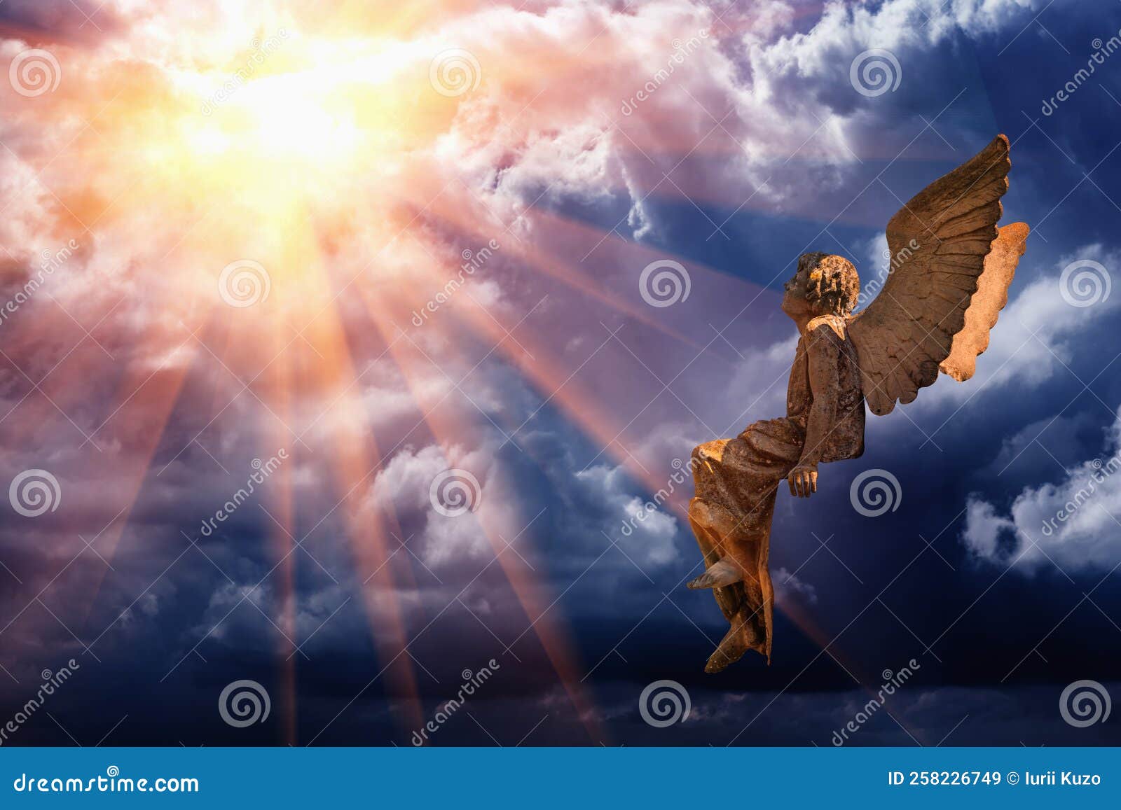 An Angel Sits on the Clouds in the Rays of the Sun. Copy Space Stock ...
