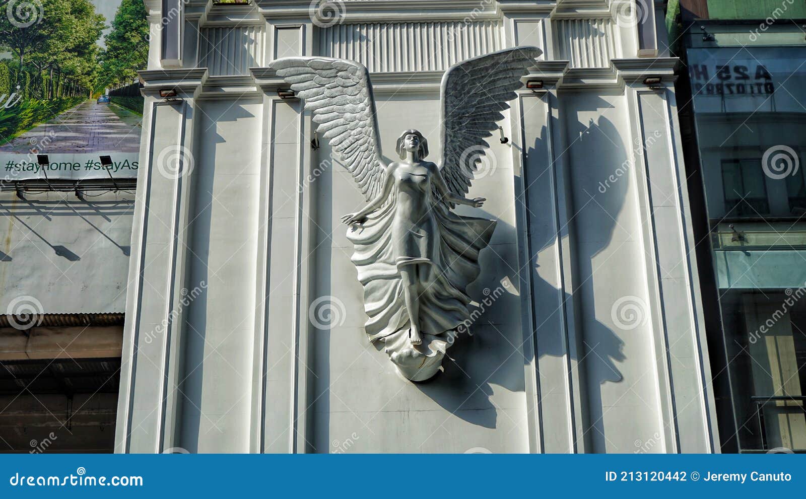 Angel Statue on Retail Store Front Stock Photo - Image of glass ...