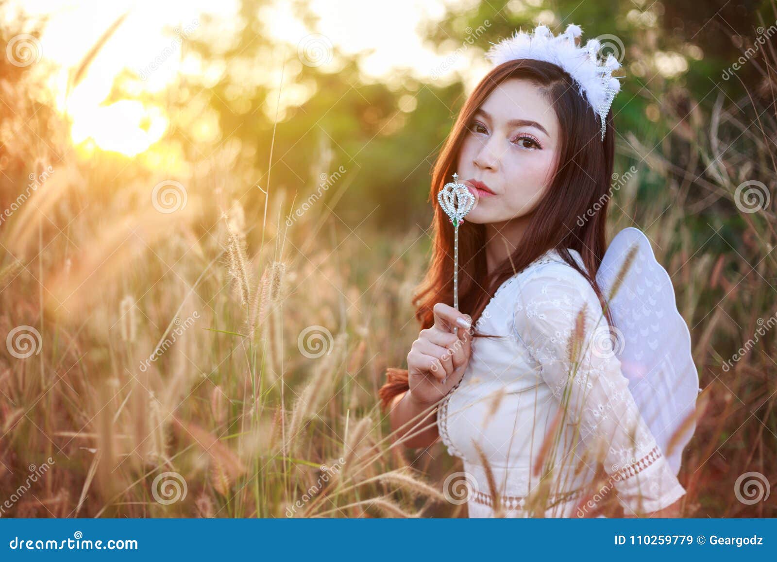 Angel Woman in a Grass Field with Sunlight Stock Image - Image of field ...