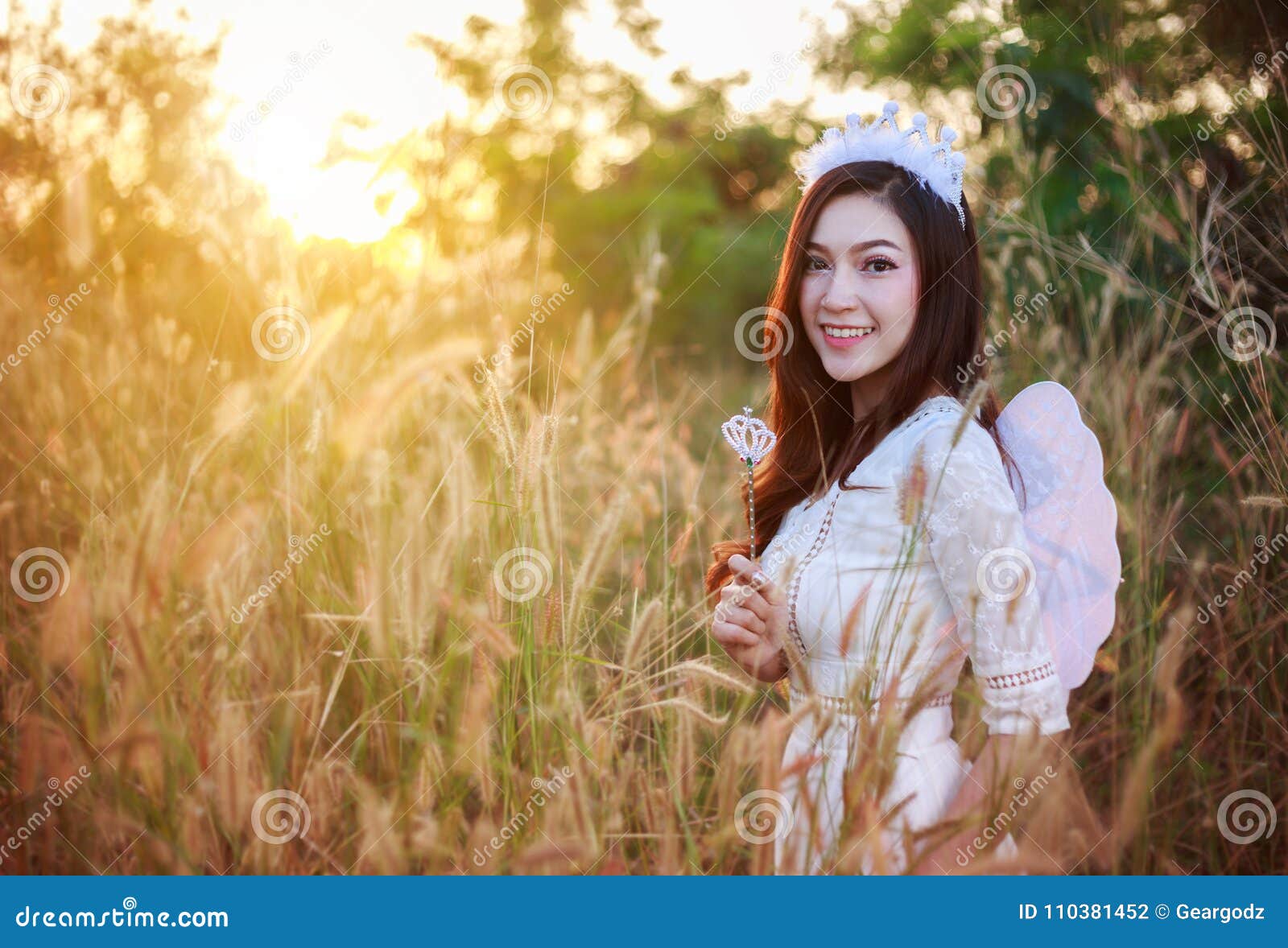 Angel Woman in a Grass Field with Sunlight Stock Photo - Image of ...