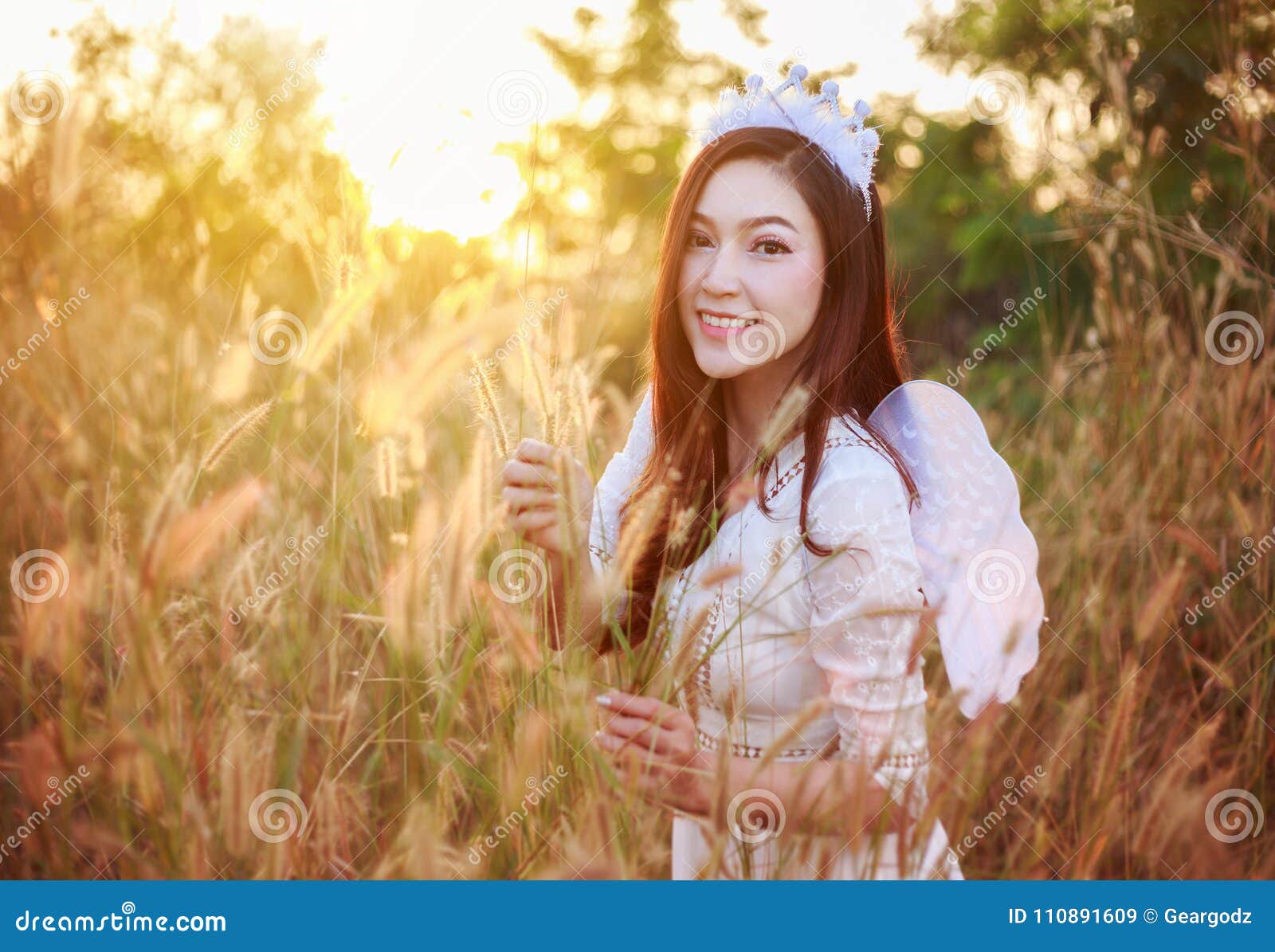 Angel Woman in a Grass Field with Sunlight Stock Image - Image of ...