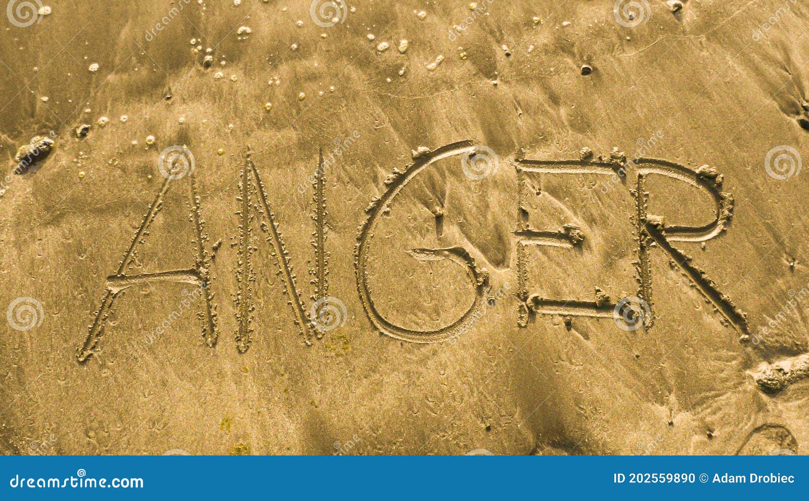 Anger Written in Golden Sand Stock Photo - Image of sunny, emotion ...