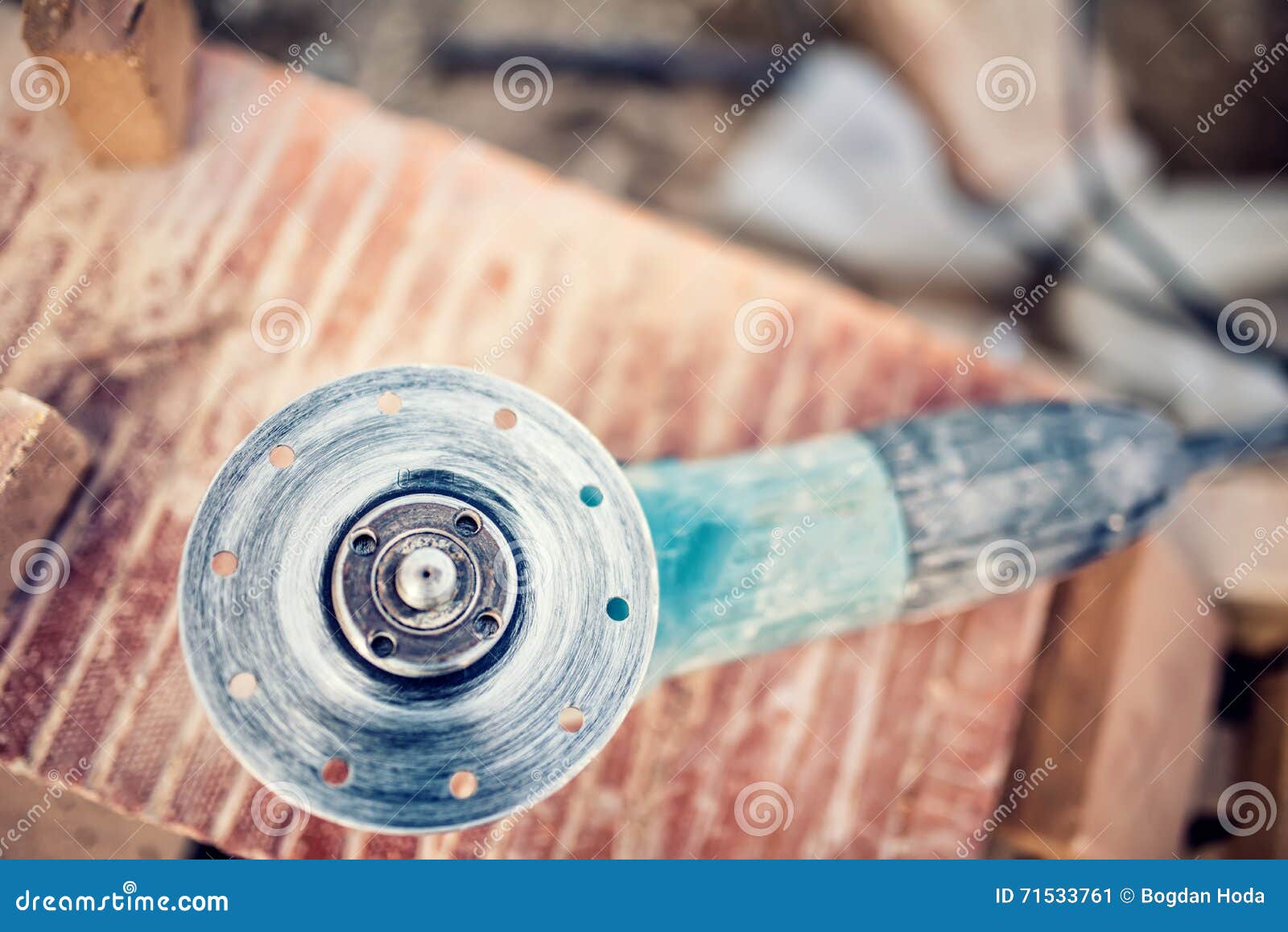 Angle Grinder on Construction Site for Cutting Bricks, Debris. Tools ...