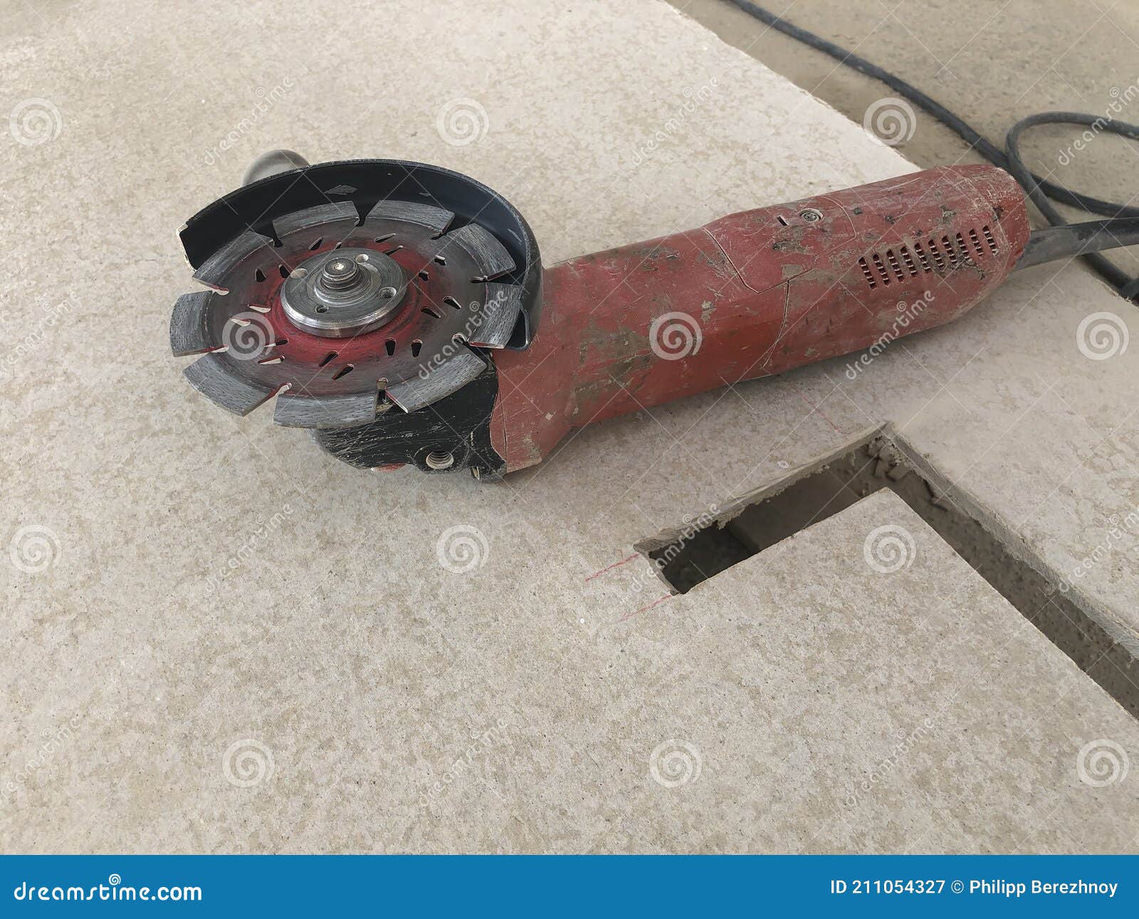 Angle Grinder and Cut Drywall Sheet. Hand Electric Power Tools Stock ...