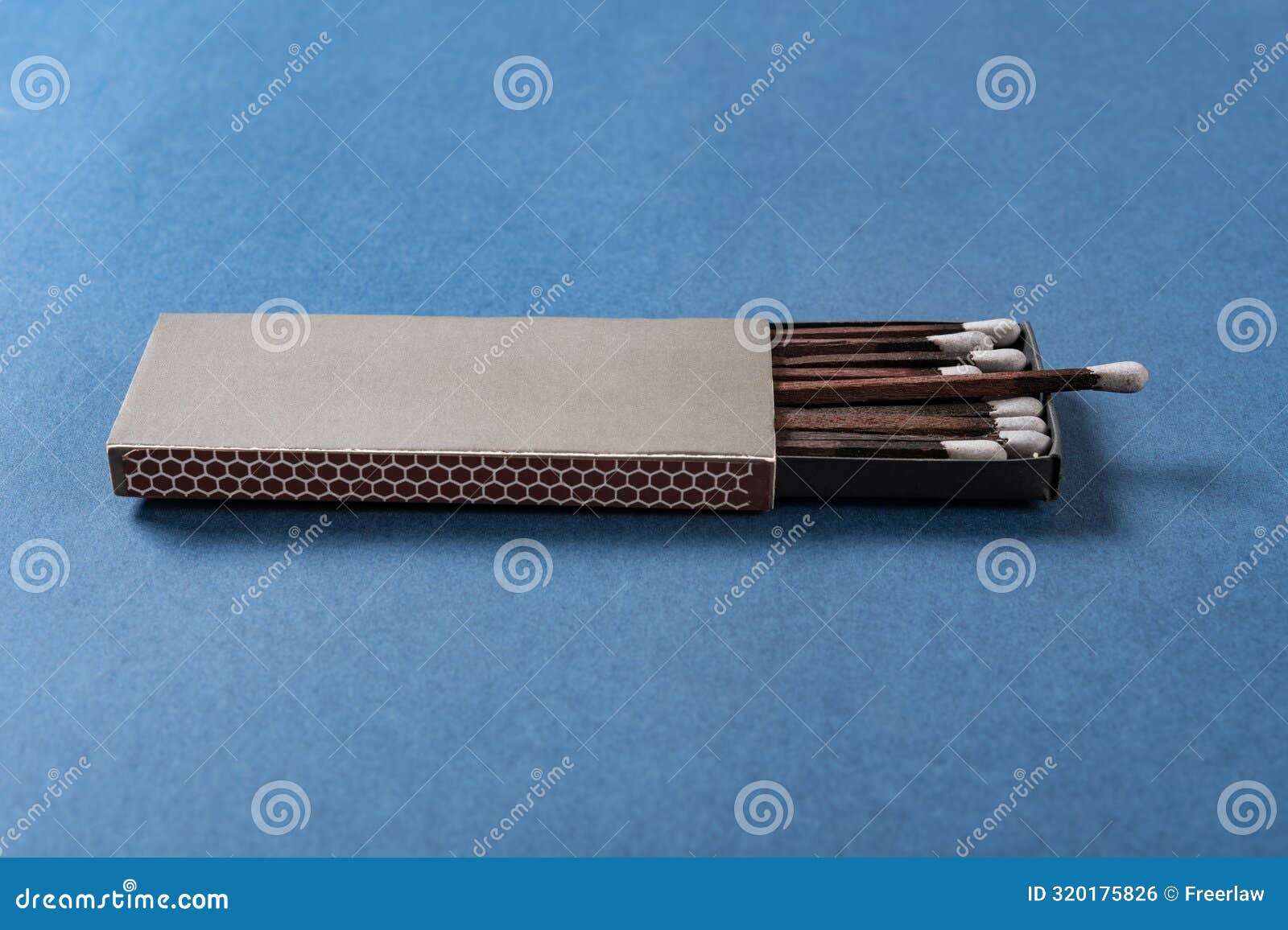 Angle View Grey Color Matchbox and Grey Match Sticks on Blue Background ...