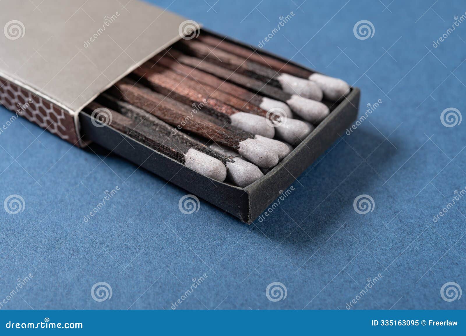 Angle View Grey Color Matchbox and Grey Match Sticks on Blue Background ...
