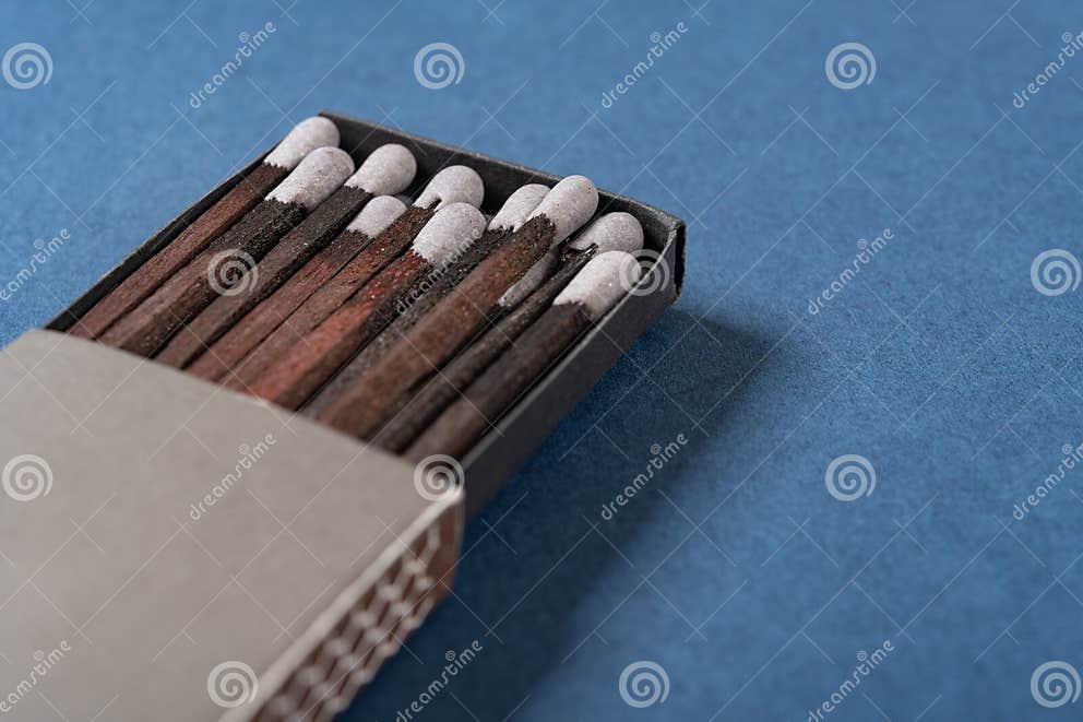 Angle View Grey Color Matchbox and Grey Match Sticks on Blue Background ...