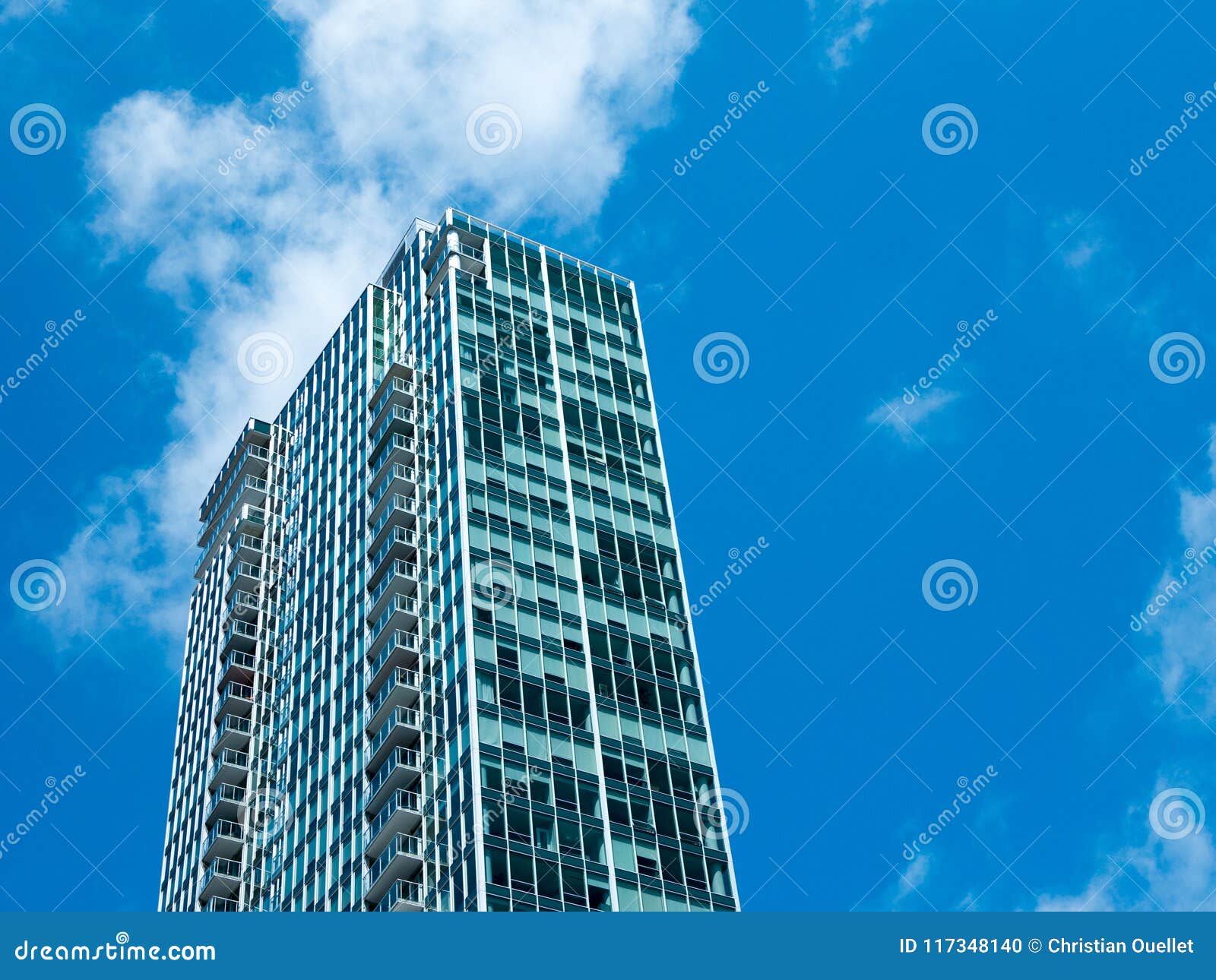 Angle View of Modern Building with a Cloudy Blue Sky in Background ...