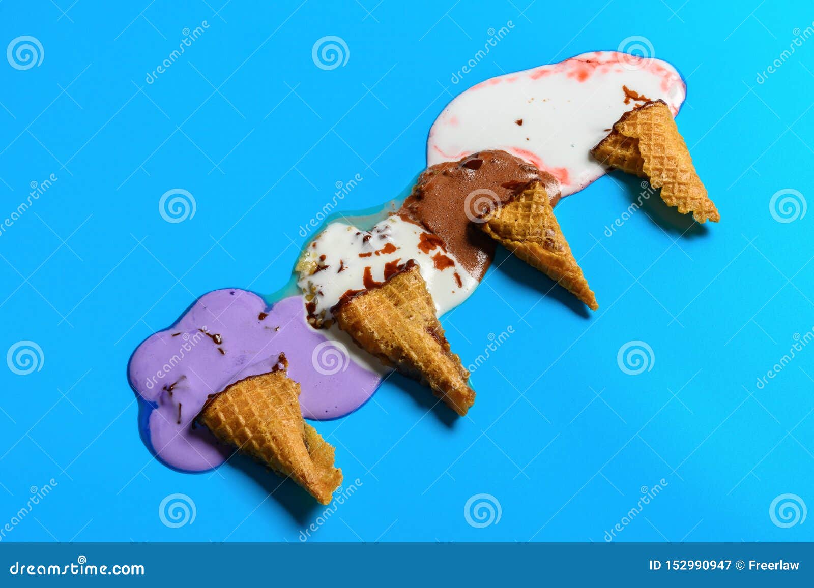 Multiple Flavor Ice Cream Cones Melted On Blue Background Royalty-Free ...