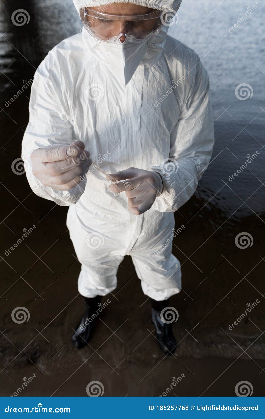 Angle View of Water Inspector in Protective Costume Taking Water Sample ...