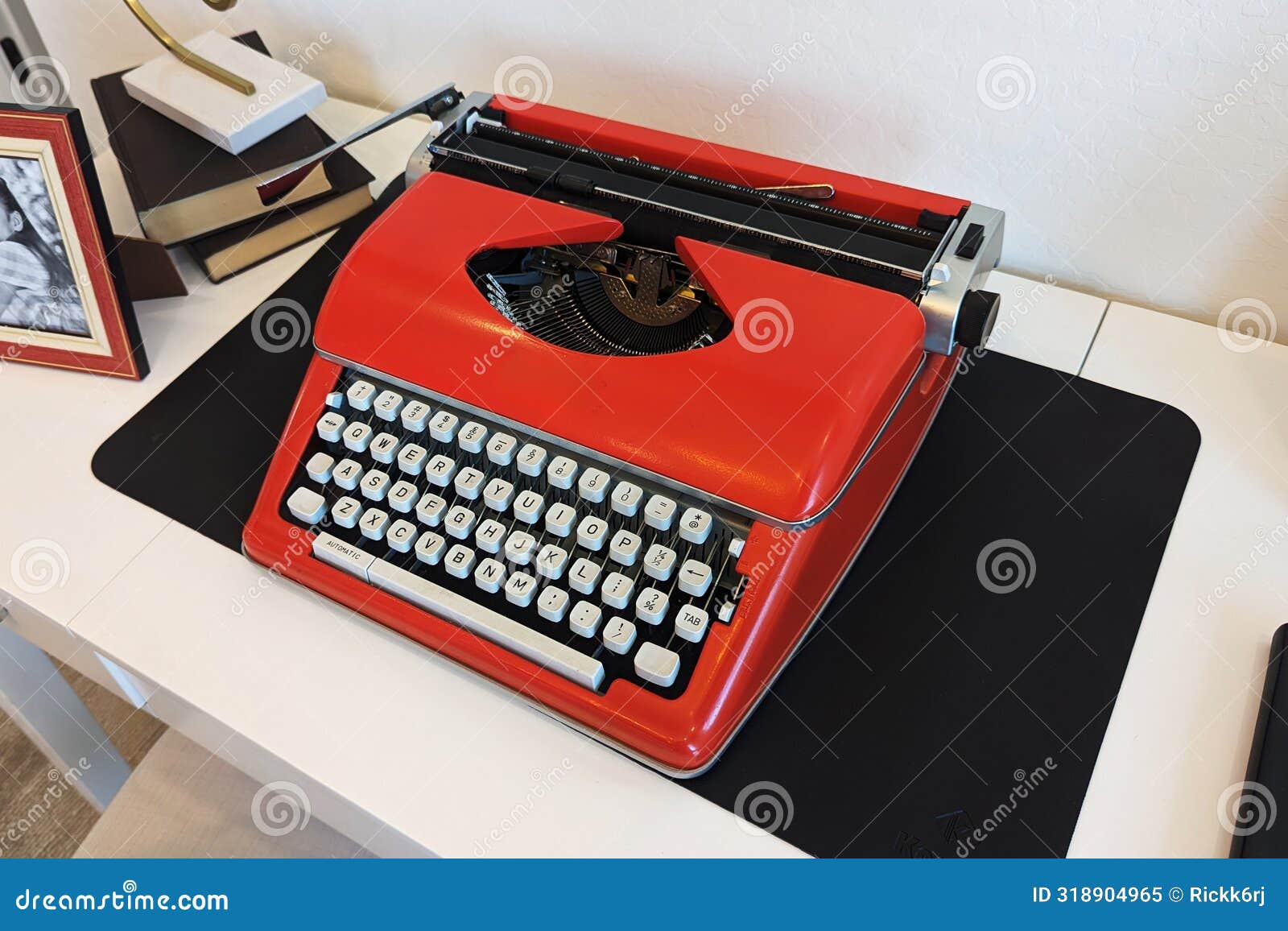 Angled Overhead View of White Desk Workplace with Bright Red Vintage ...