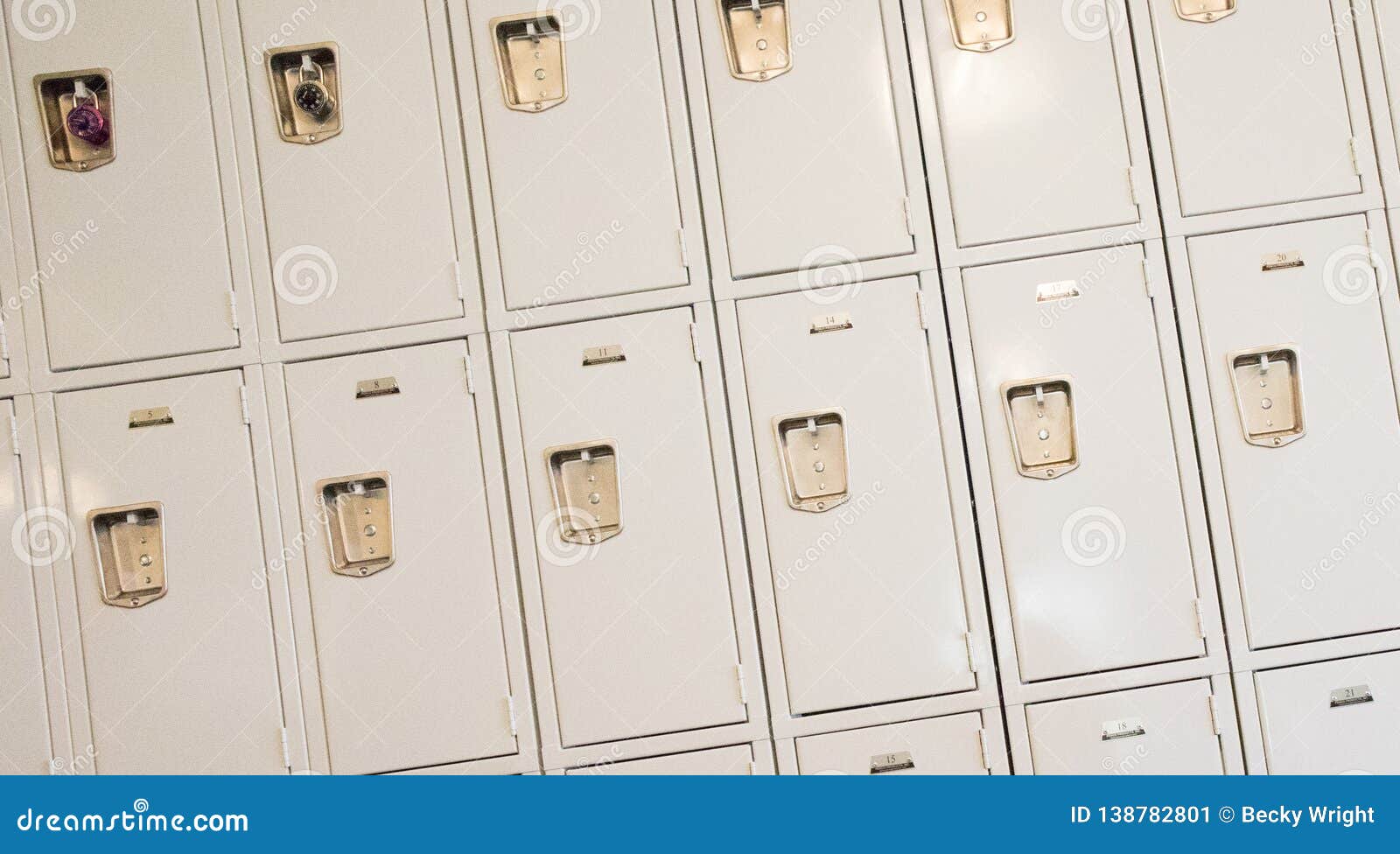 An Angled Photo of a Row of Tan Lockers in an Education Setting. Stock ...