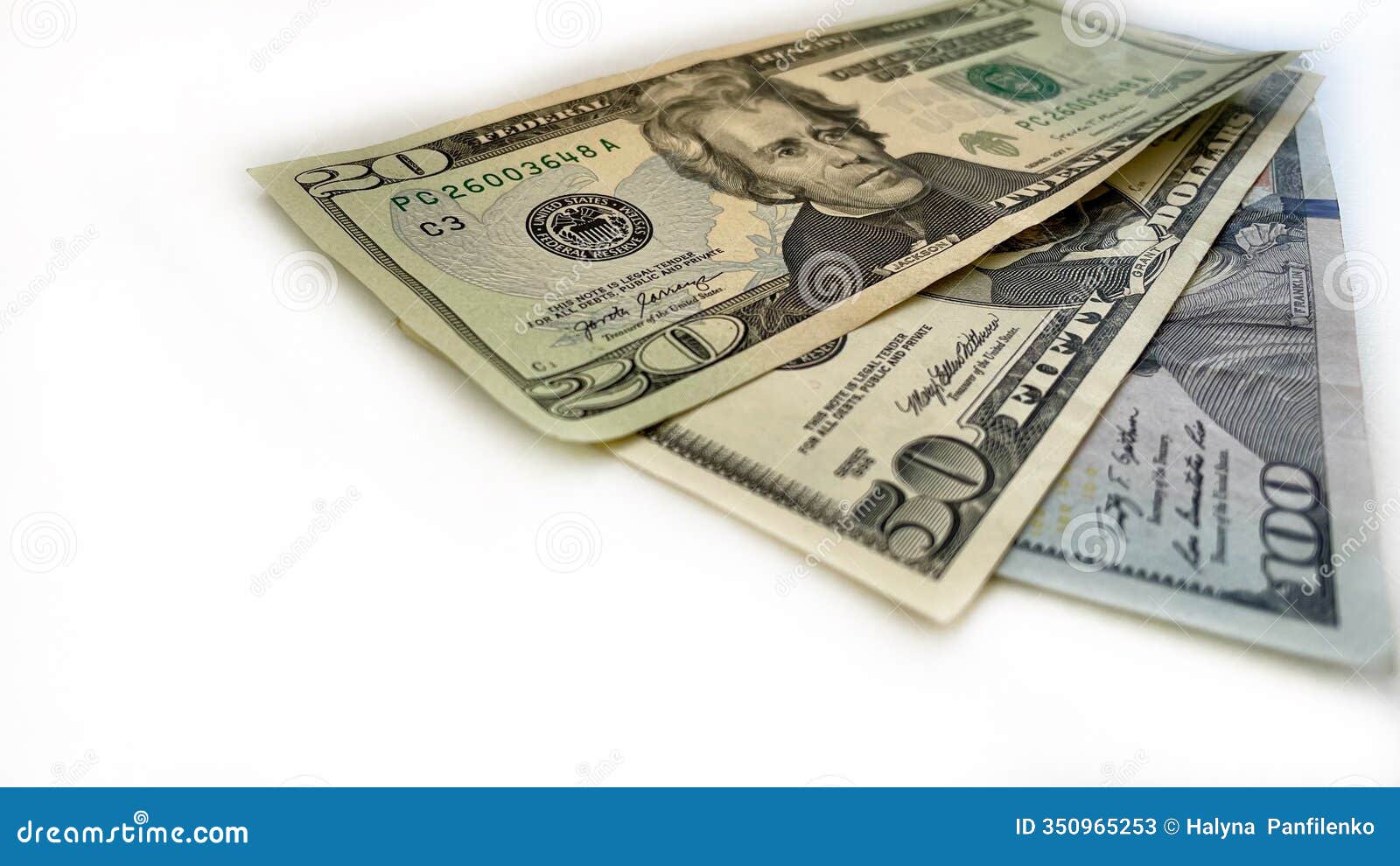 Angled Stack of US Dollar Bills Including 20, 50, and 100 Notes on a ...