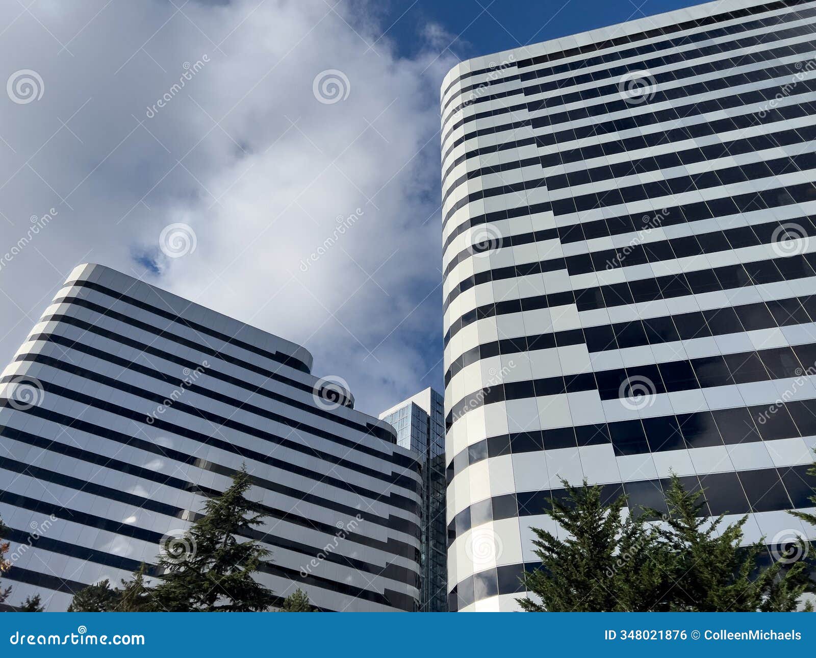 Angled View of a Large, Window Covered Building Corner Against a Blue ...