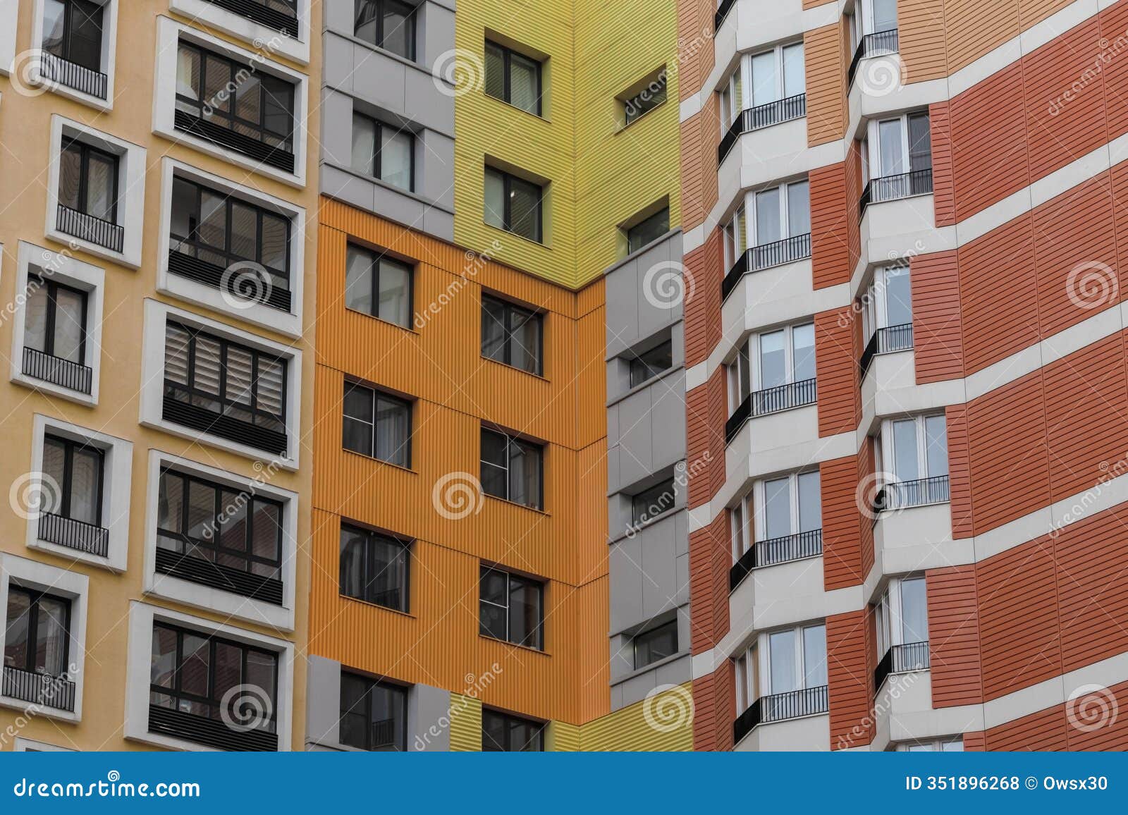 Angled View of a Modern Building Facade with Orange Cladding and ...
