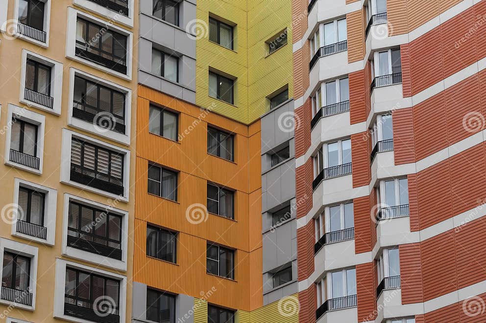 Angled View of a Modern Building Facade with Orange Cladding and ...