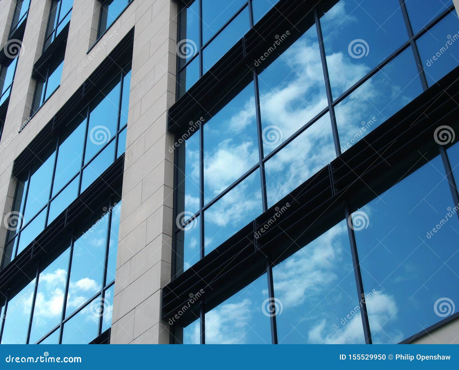 View of a Modern Commercial Building with Large Mirrored Windows ...