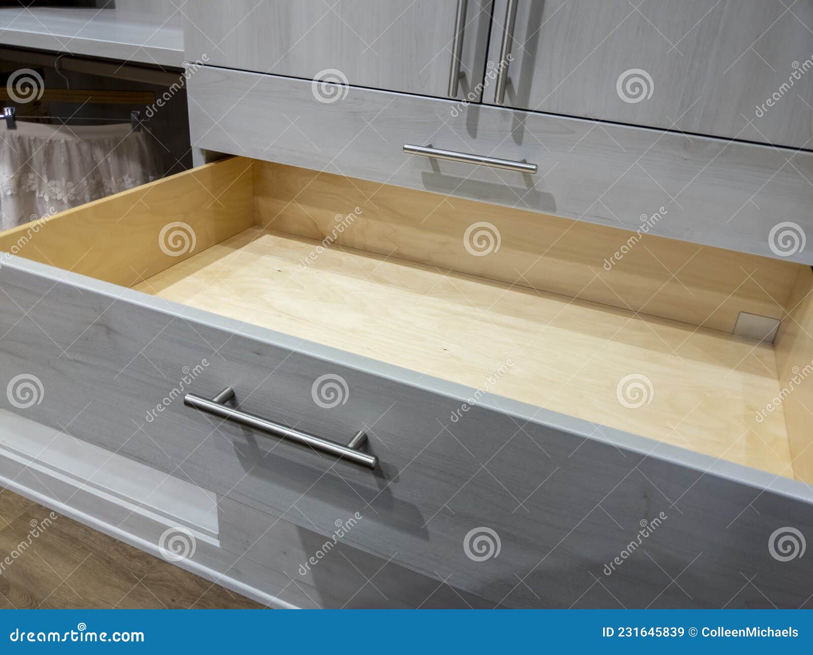 View Of An Open, Empty Dresser Drawer Inside A Large, Spacious Walk In ...