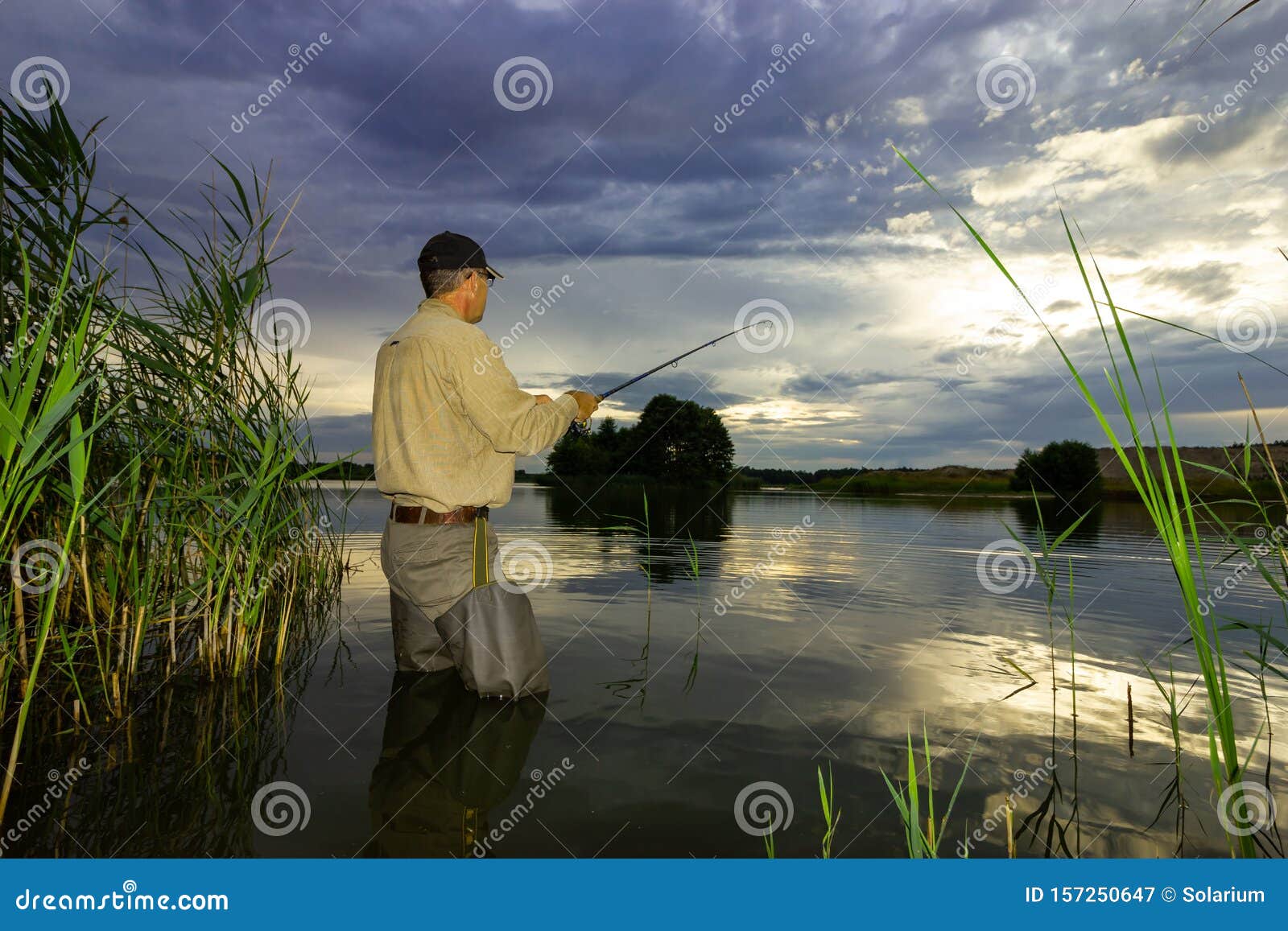 Angler stock image. Image of reel, recreation, reed - 157250647