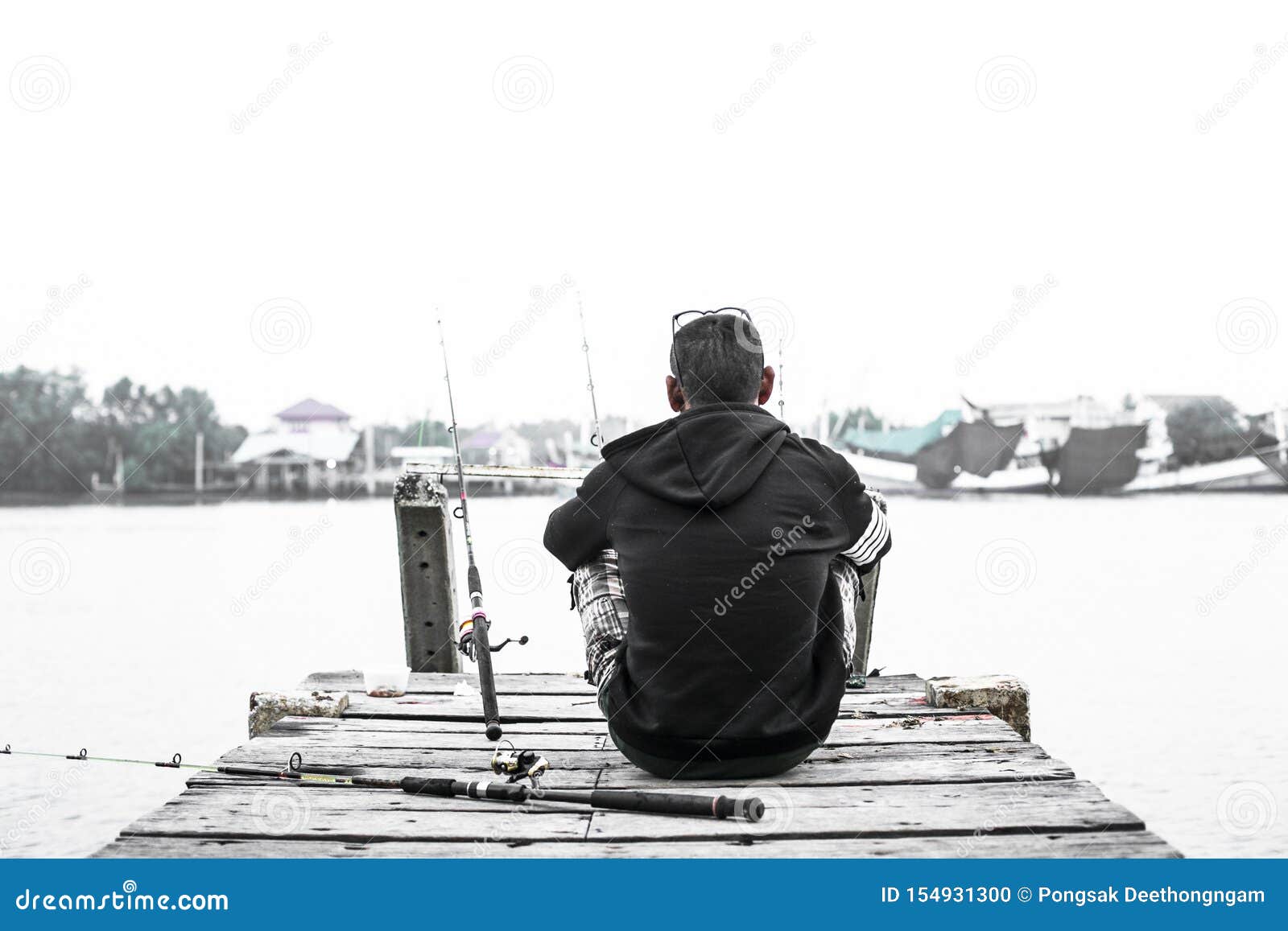 Angler catching fish stock photo. Image of lone, pole - 154931300