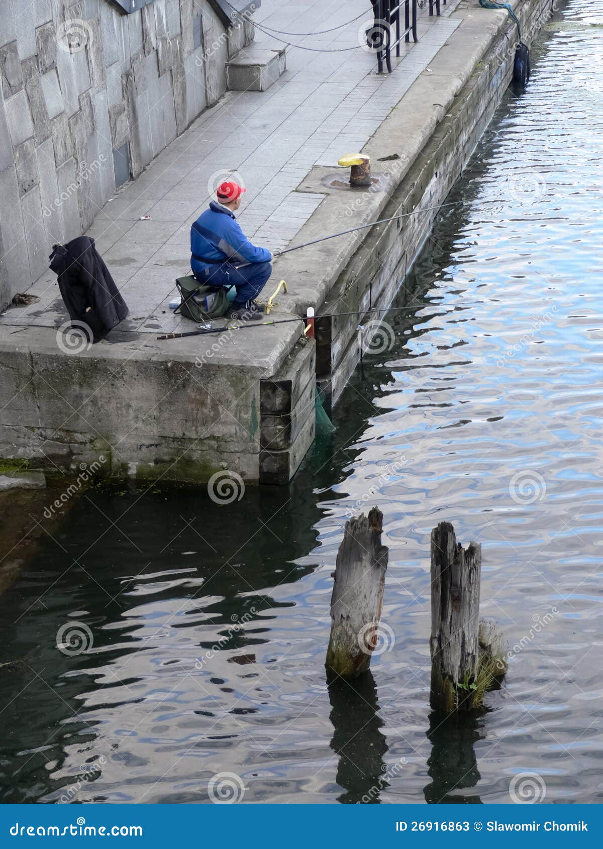 Angler in old port editorial stock photo. Image of blue - 26916863