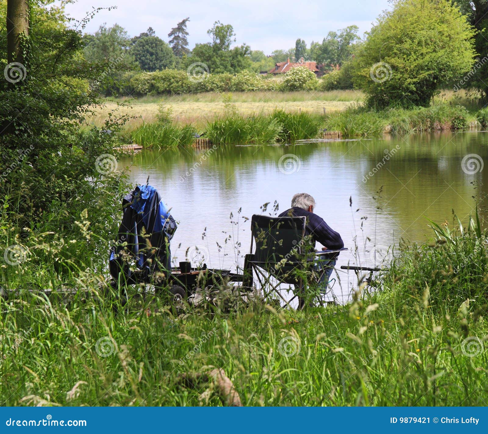Angler sitting by a Lake stock image. Image of pastime - 9879421